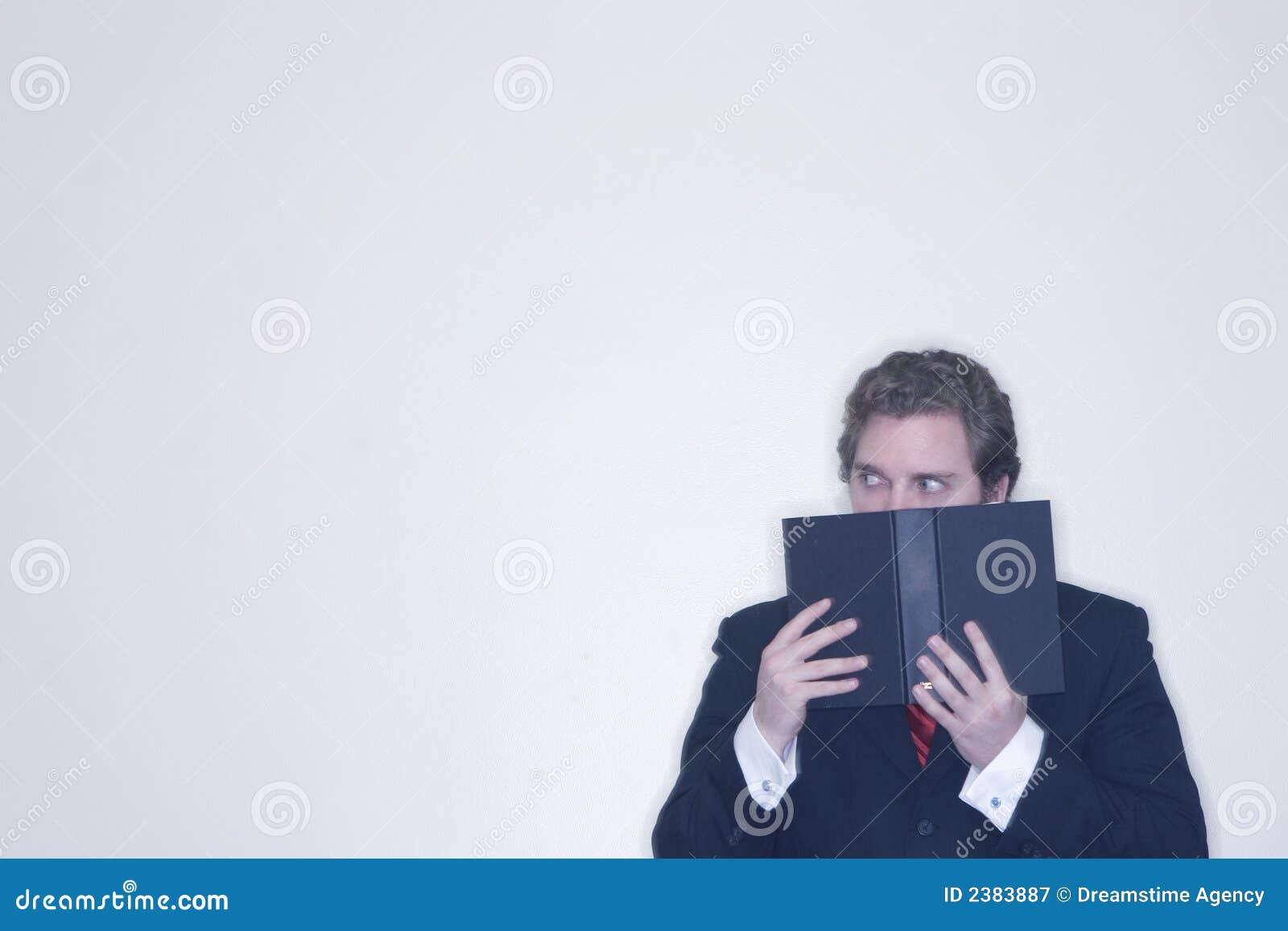 Guy Behind Book stock image. Image of male, spying, watching - 2383887