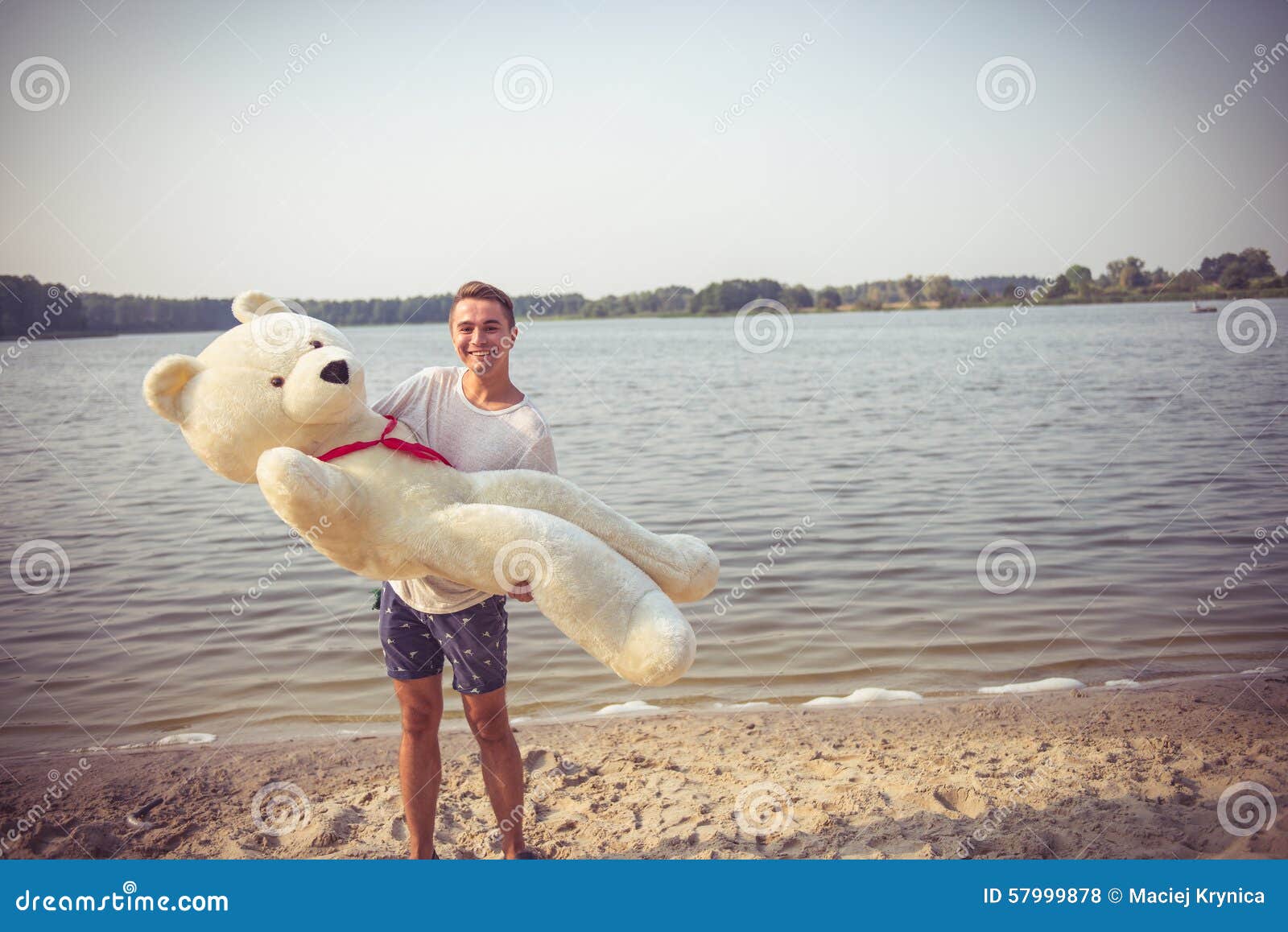 Guy with a big teddy bear stock photo. Image of expression - 57999878