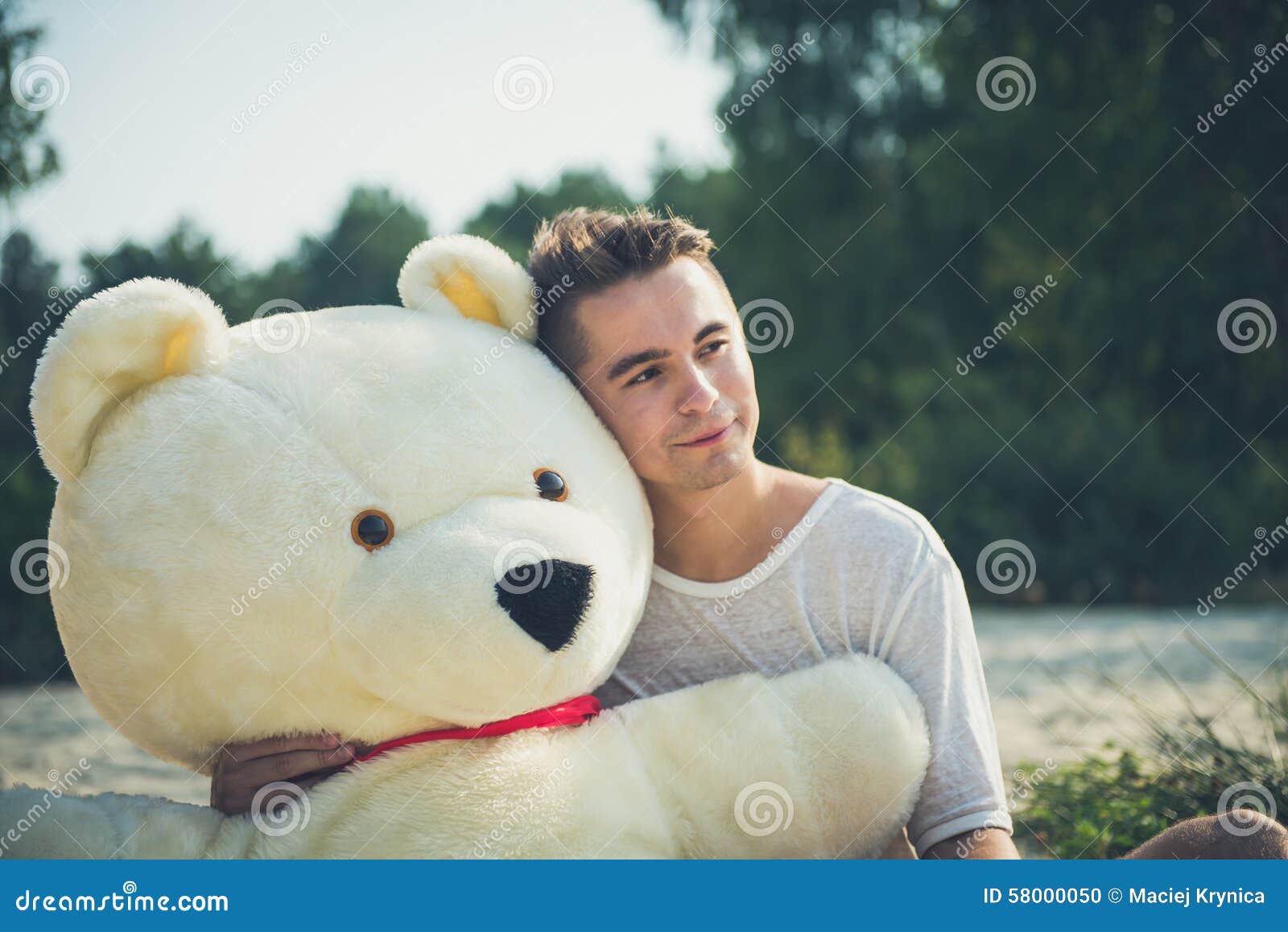 Guy with a big teddy bear stock photo. Image of furry - 58000050