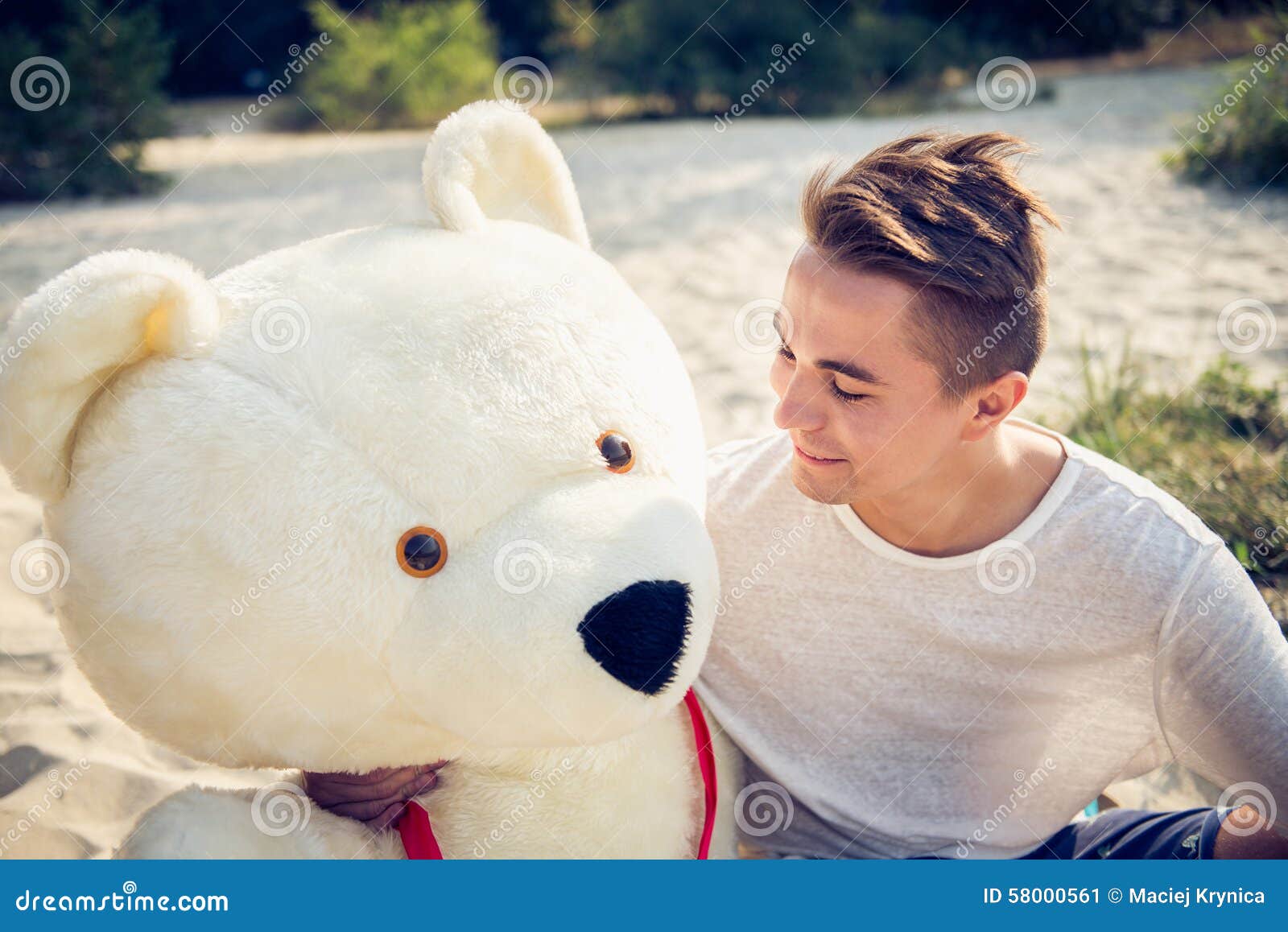Guy with a big teddy bear stock image. Image of female - 58000561
