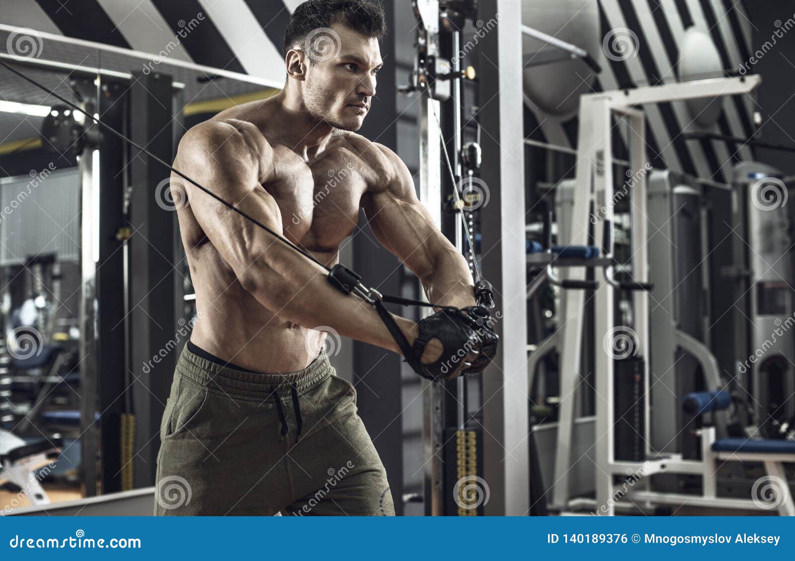 Guy Bodybuilder with Exercise Machine Stock Photo - Image of muscles ...