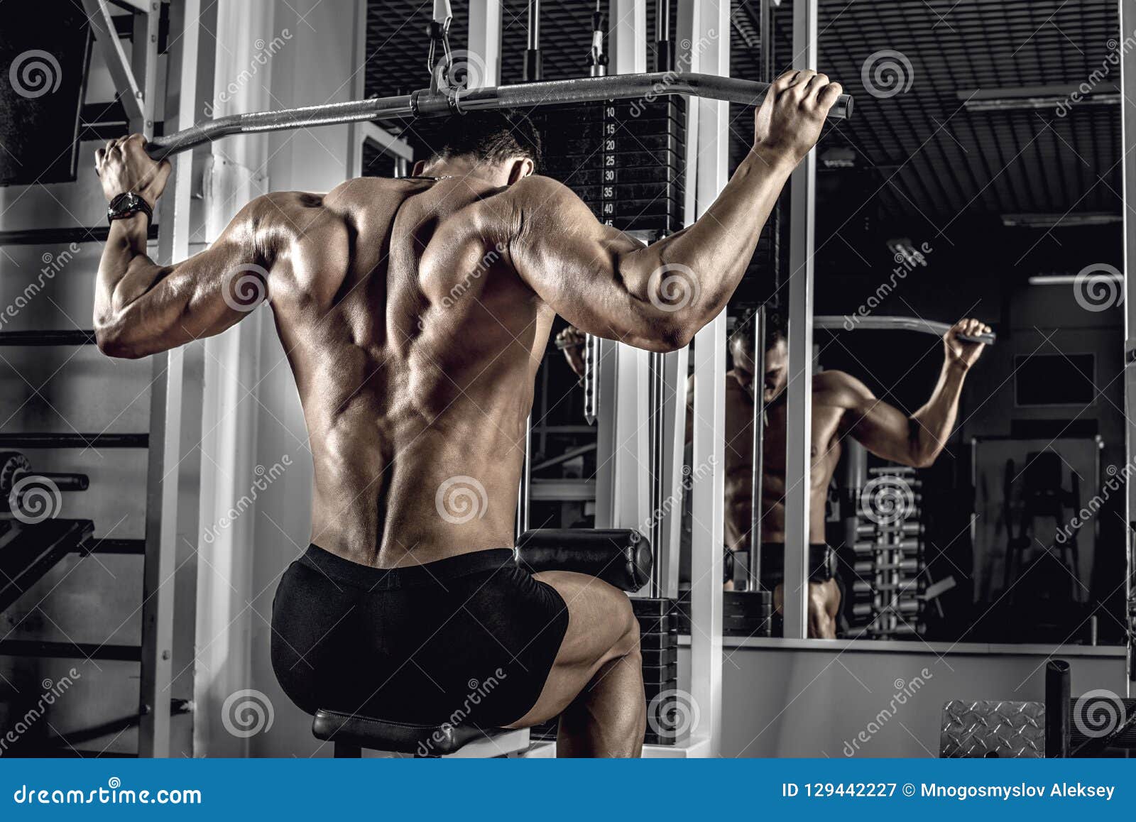 Guy Bodybuilder with Exercise Machine Stock Image - Image of power ...