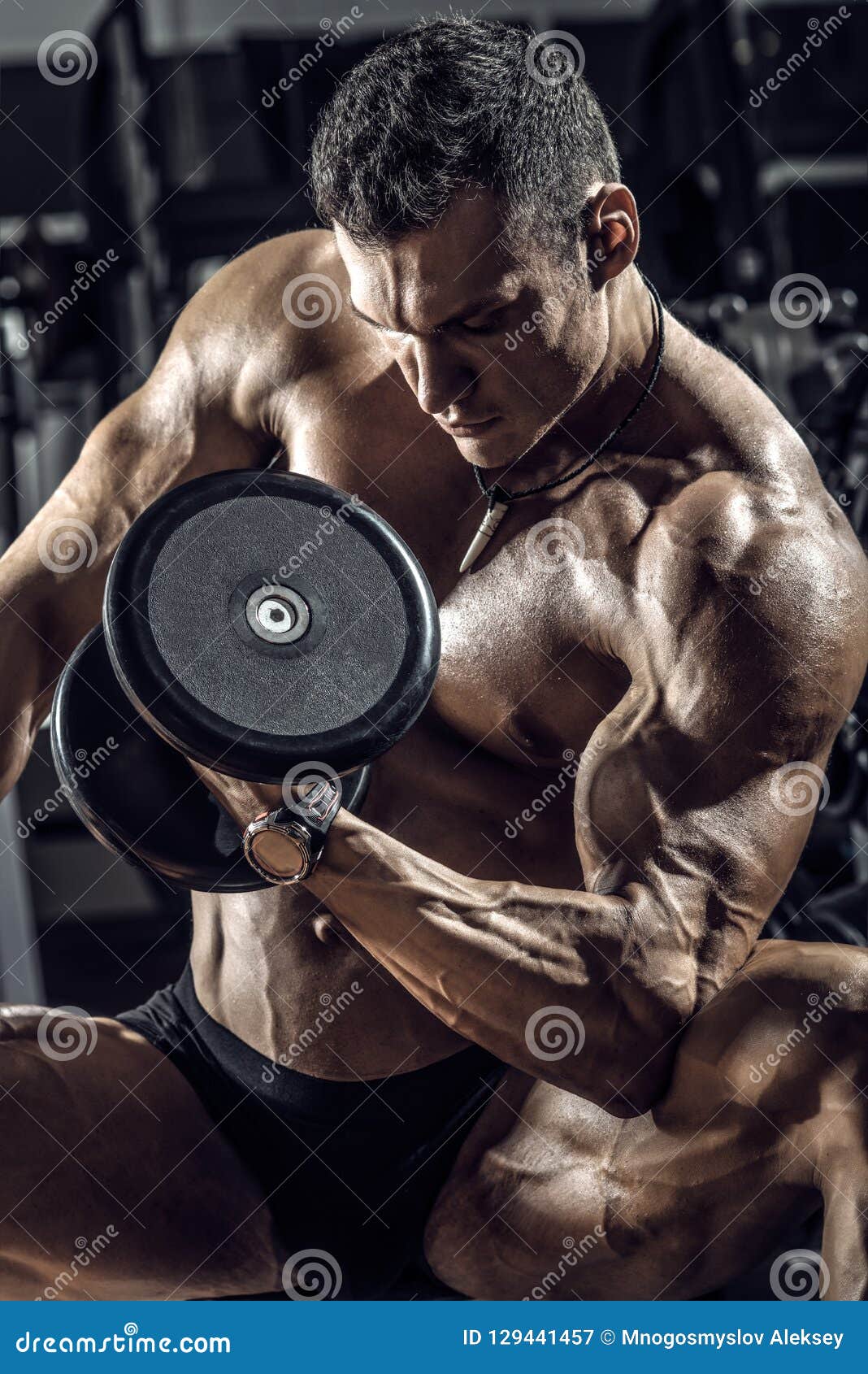 Guy Bodybuilder with Dumbbell Stock Image - Image of dark, sportive ...