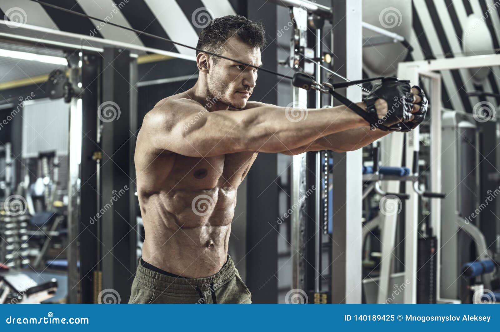 Guy Bodybuilder with Exercise Machine Stock Image - Image of ...
