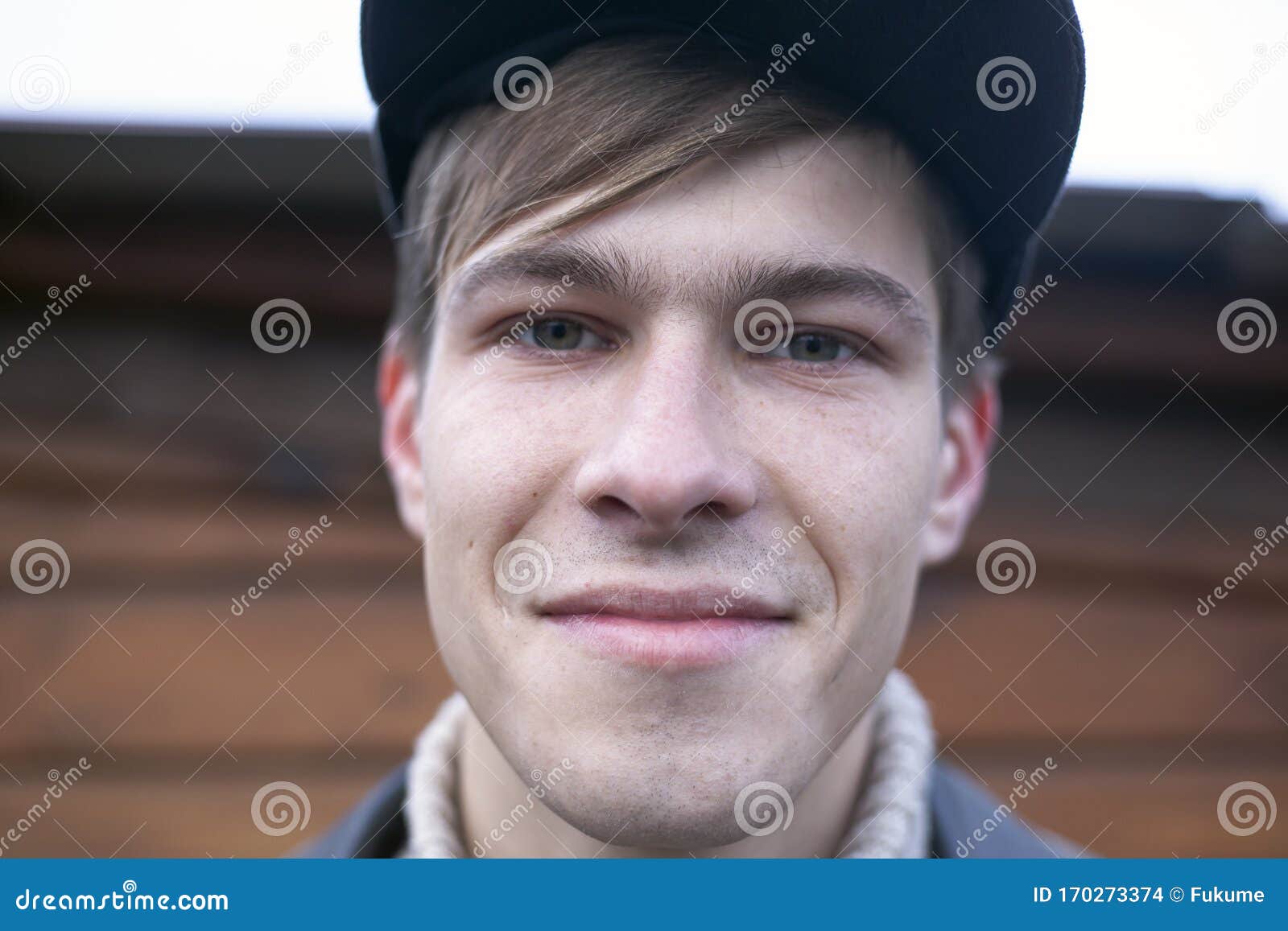 A Guy in a Cap 21-23 Years Old Model Looks Smiling at the Camera ...