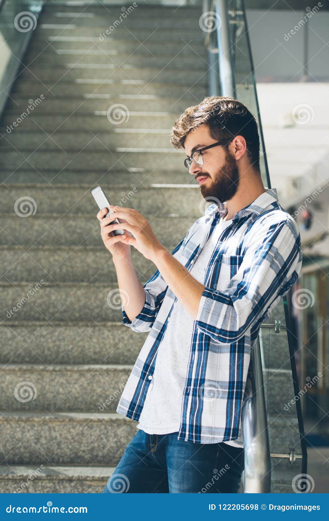 Guy checking smartphone stock photo. Image of handsome - 122205698