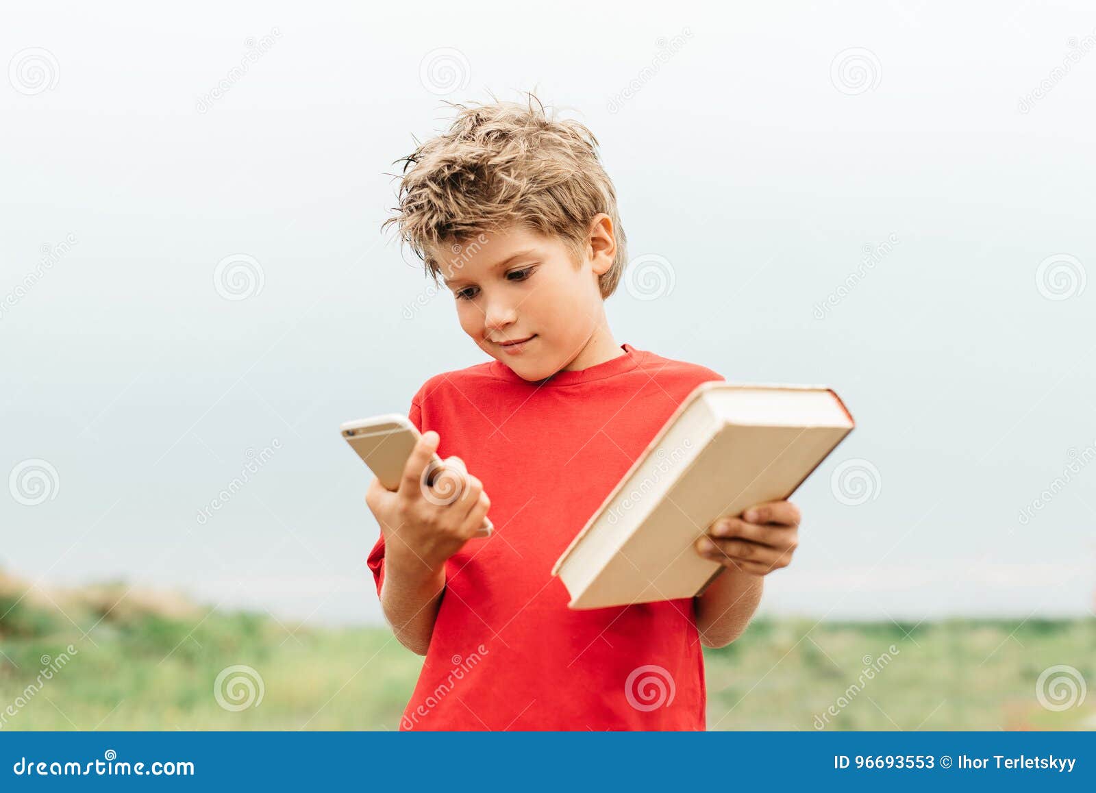 The Guy Chooses between a Book and a Smartphone Stock Image - Image of ...