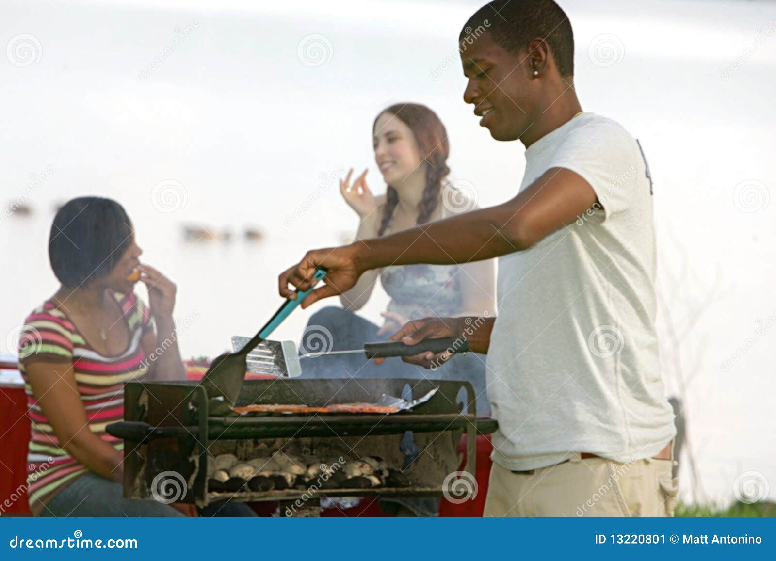 Guy cooking bbq stock image. Image of friends, ethnic - 13220801
