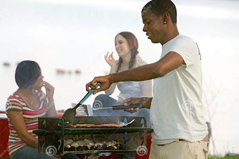 Guy cooking bbq stock image. Image of friends, ethnic - 13220801