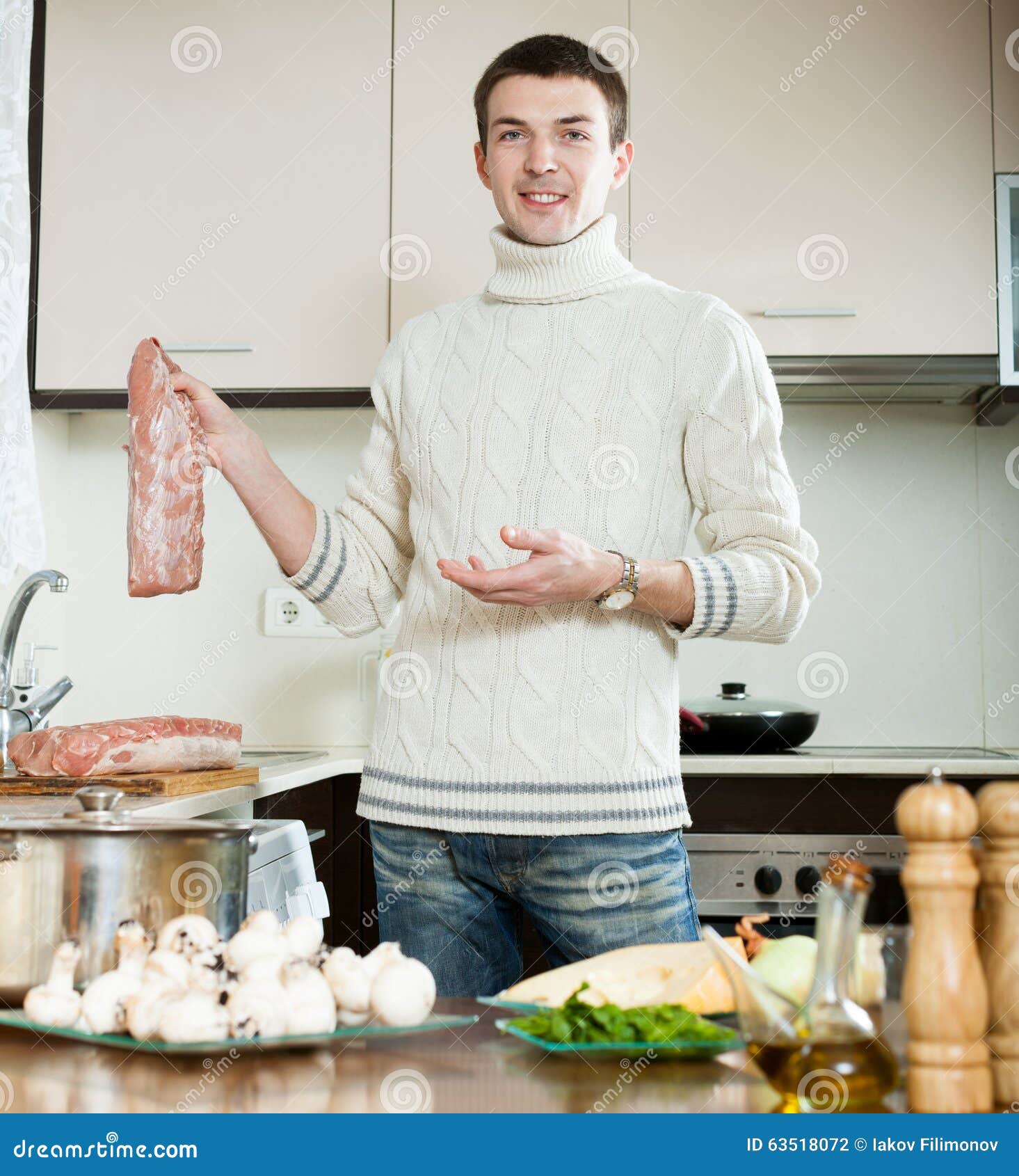 Guy Cooking Raw Meat in Kitchen Stock Photo - Image of home, meat: 63518072