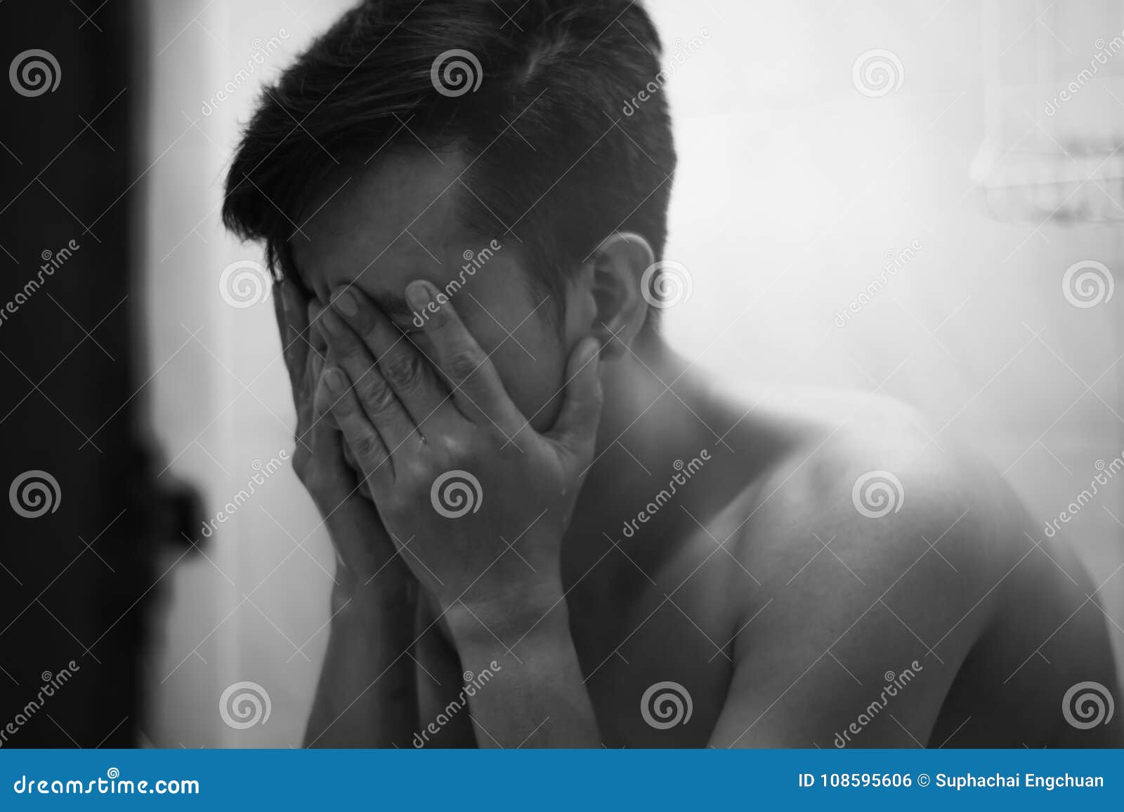 Guy crying in the bathroom stock photo. Image of depressed - 108595606
