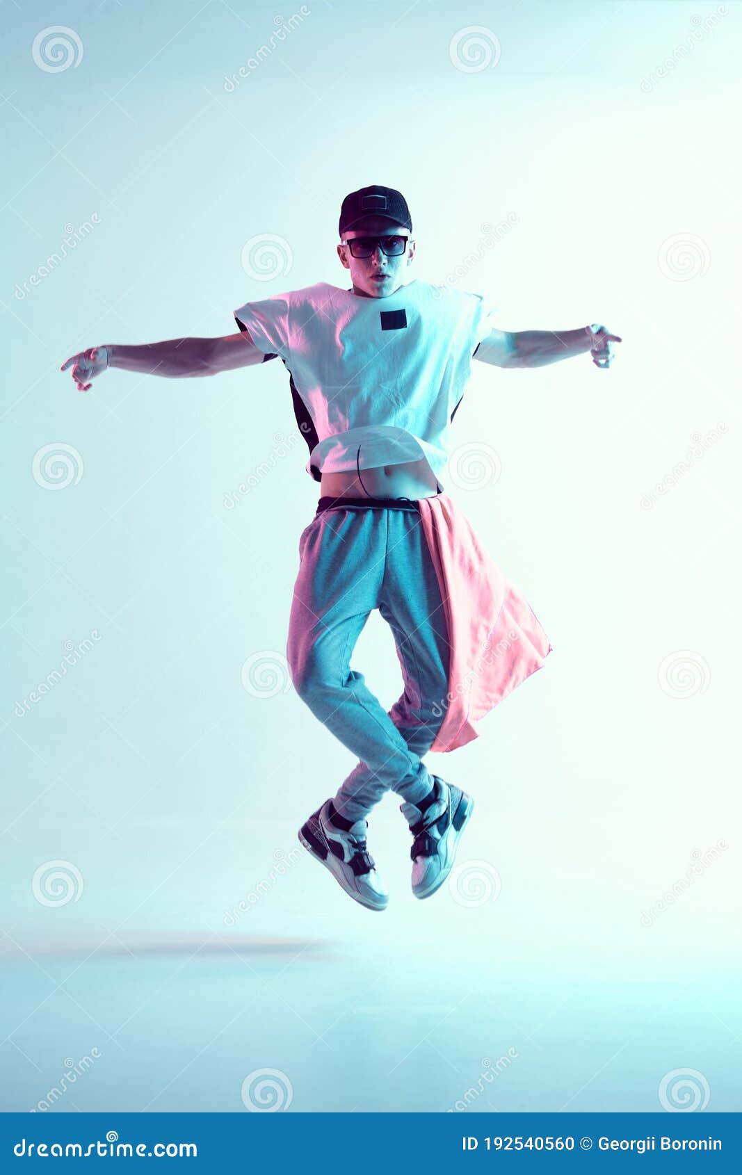 Guy Dancing Contemporary Dance in Studio. Neon Light Blue Background ...
