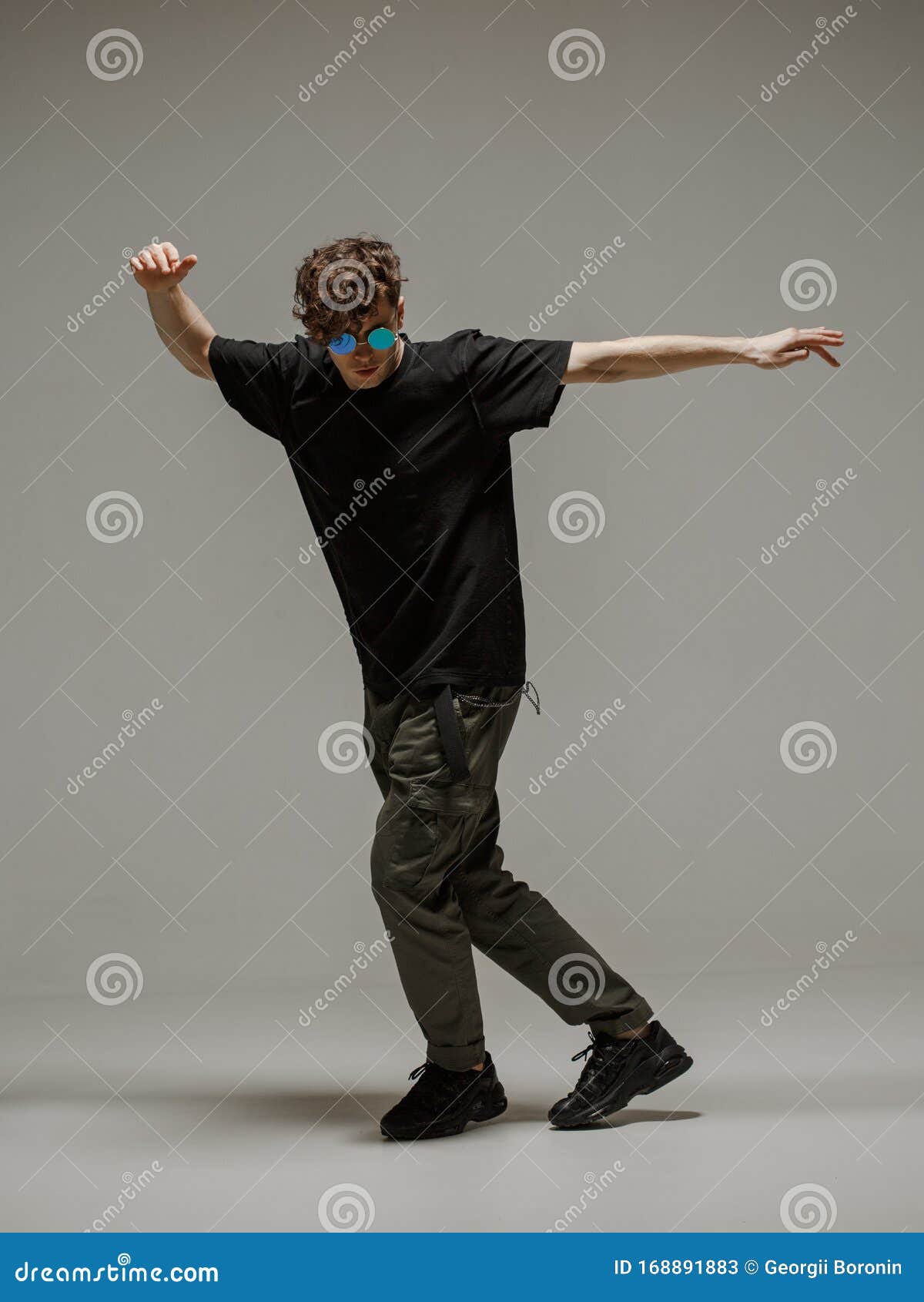 Guy Dancing Contemporary Dance in Studio. Neutral Grey Background ...