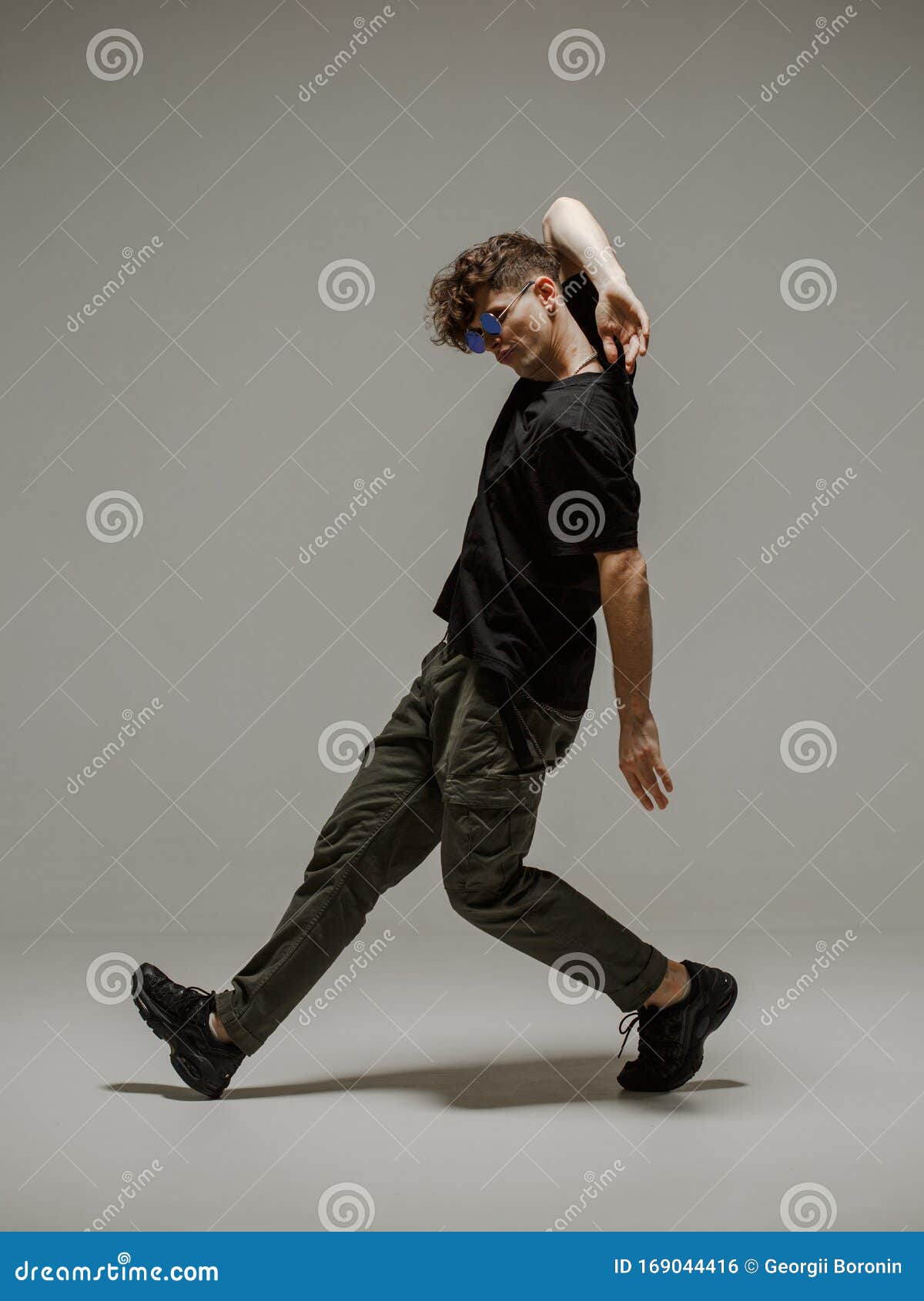 Guy Dancing Contemporary Dance in Studio. Neutral Grey Background ...