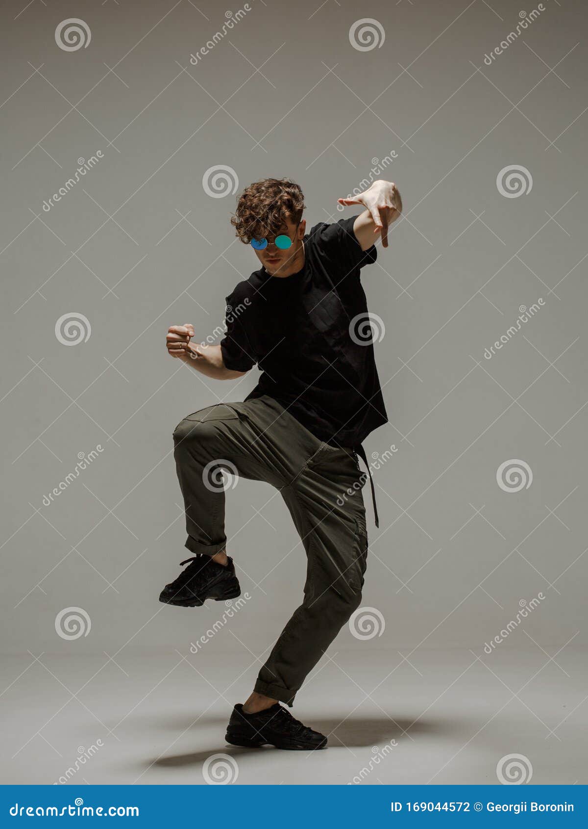 Guy Dancing Contemporary Dance in Studio. Neutral Grey Background ...