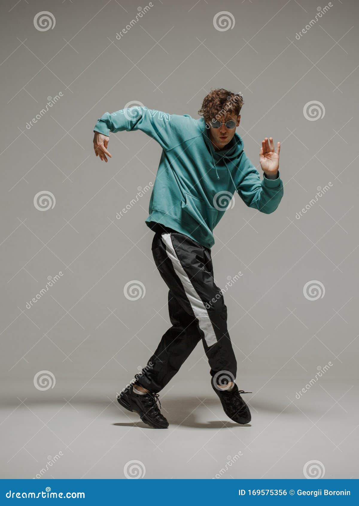 Guy Dancing Contemporary Dance in Studio. Neutral Grey Background ...
