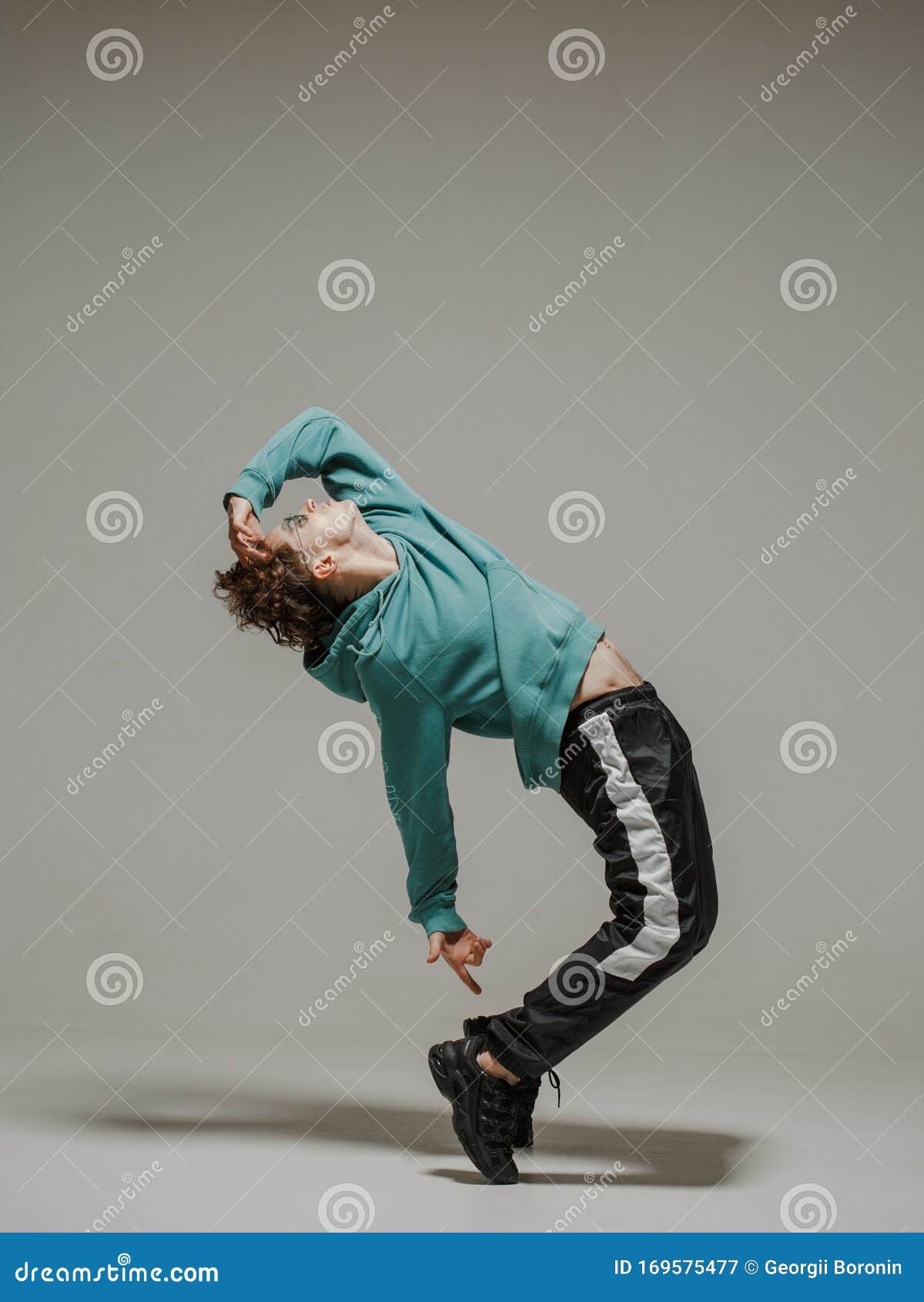 Guy Dancing Contemporary Dance in Studio. Neutral Grey Background ...