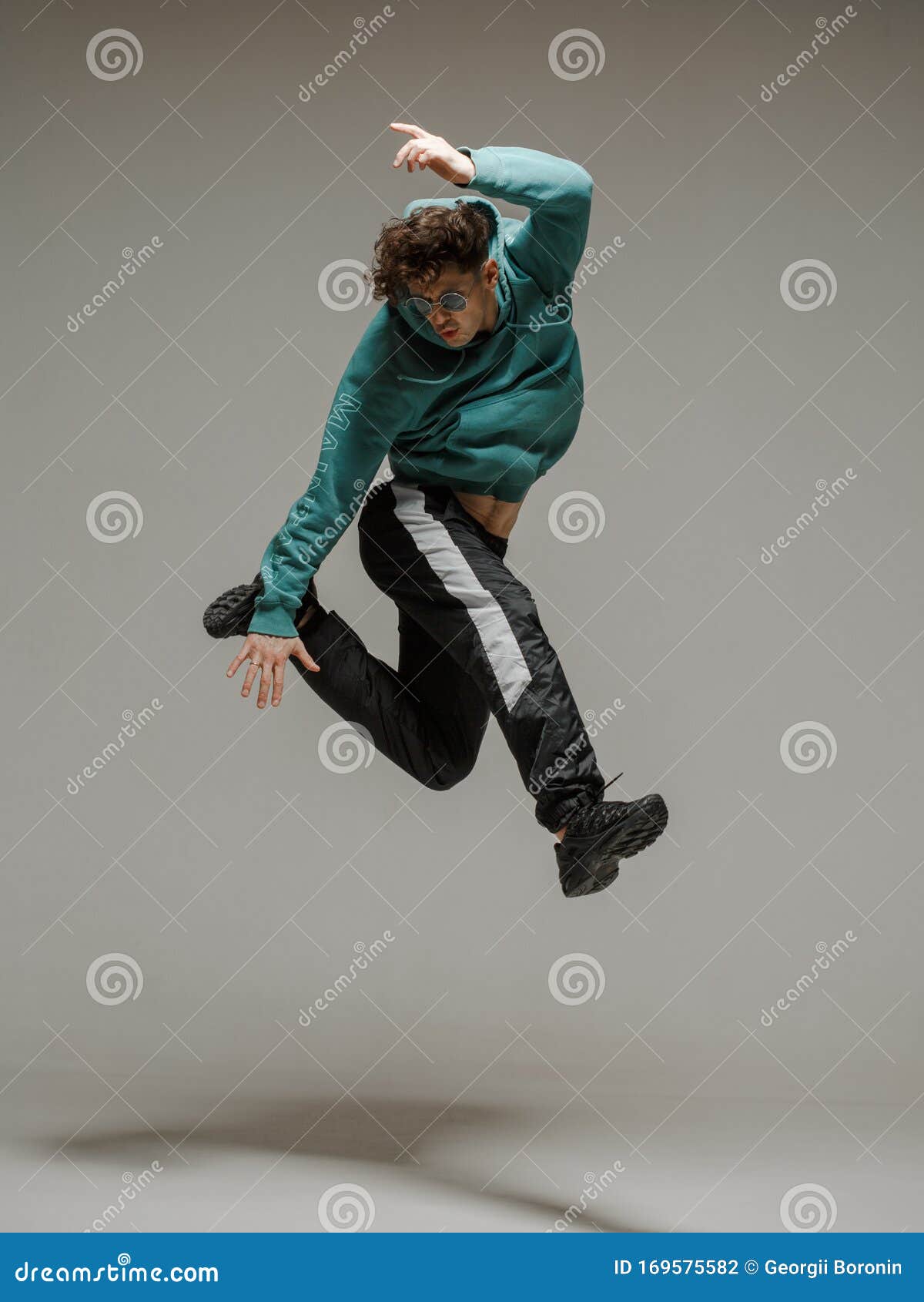 Guy Dancing Contemporary Dance in Studio. Neutral Grey Background ...
