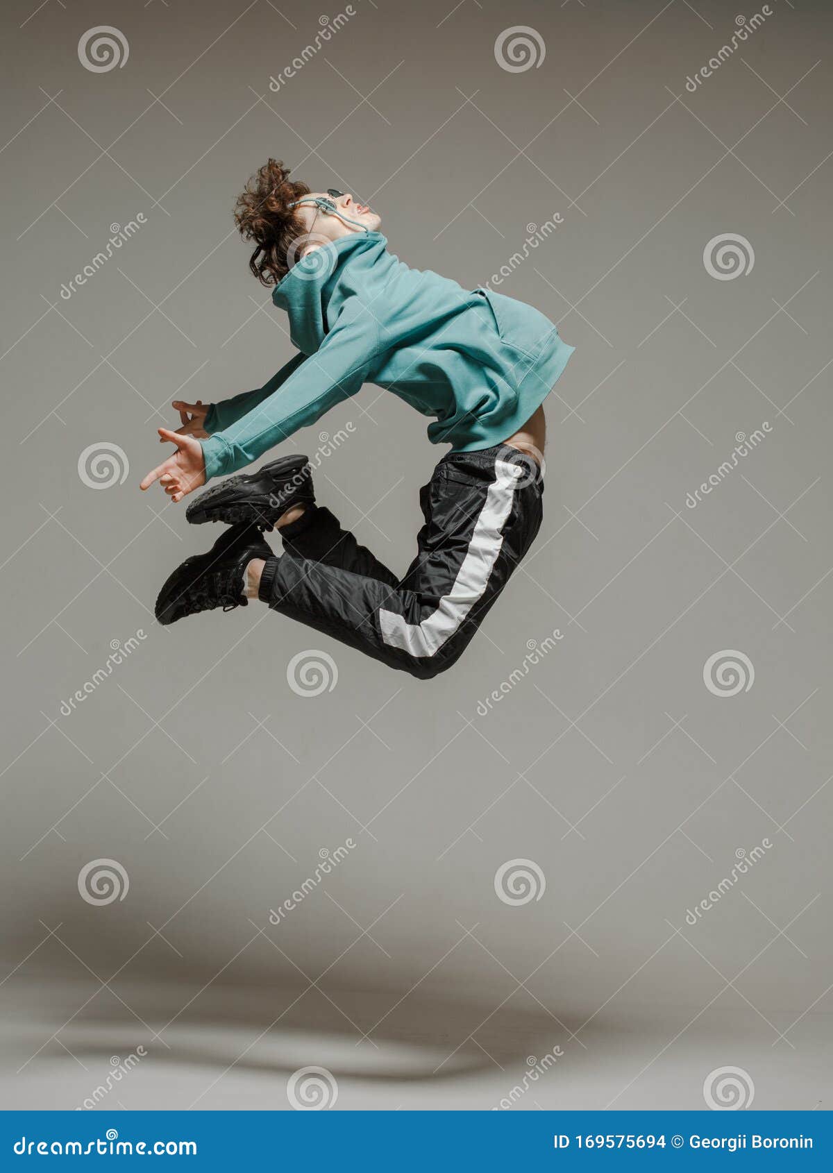Guy Dancing Contemporary Dance in Studio. Neutral Grey Background ...