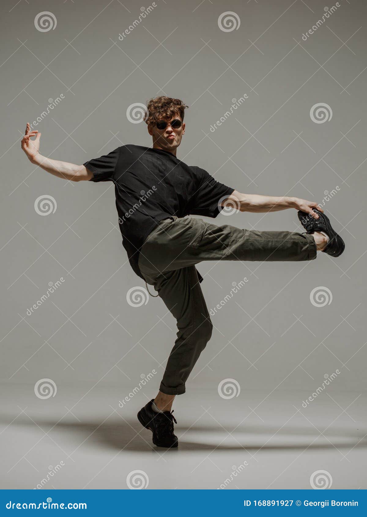 Guy Dancing Contemporary Dance in Studio. Neutral Grey Background ...