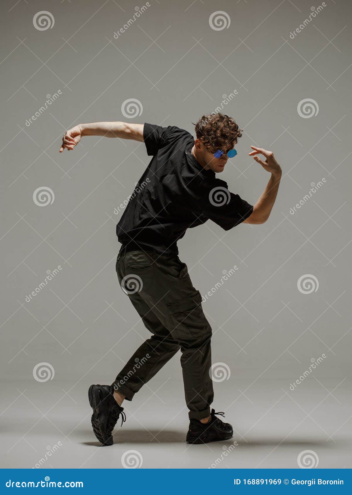 Guy Dancing Contemporary Dance in Studio. Neutral Grey Background ...