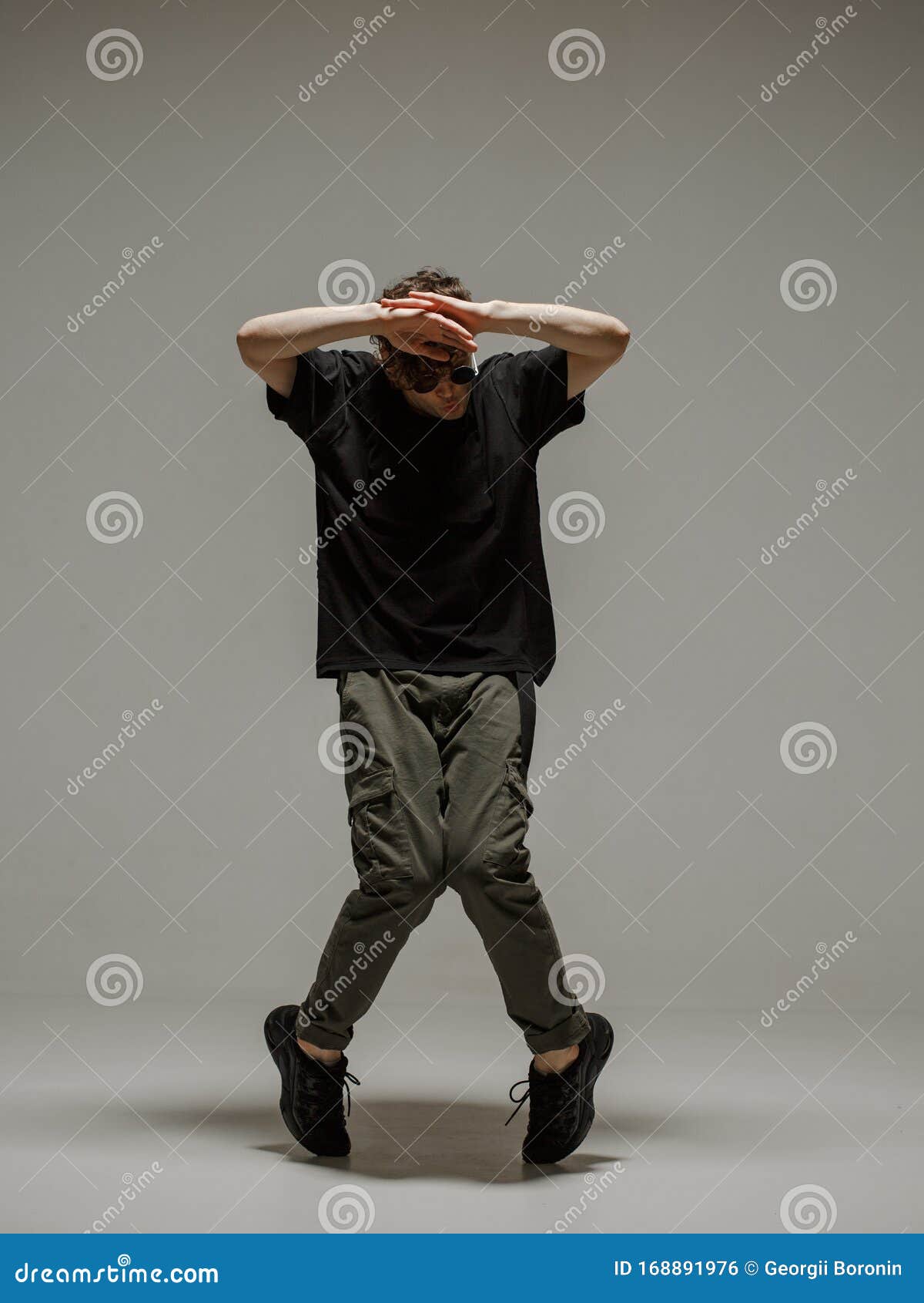 Guy Dancing Contemporary Dance in Studio. Neutral Grey Background ...