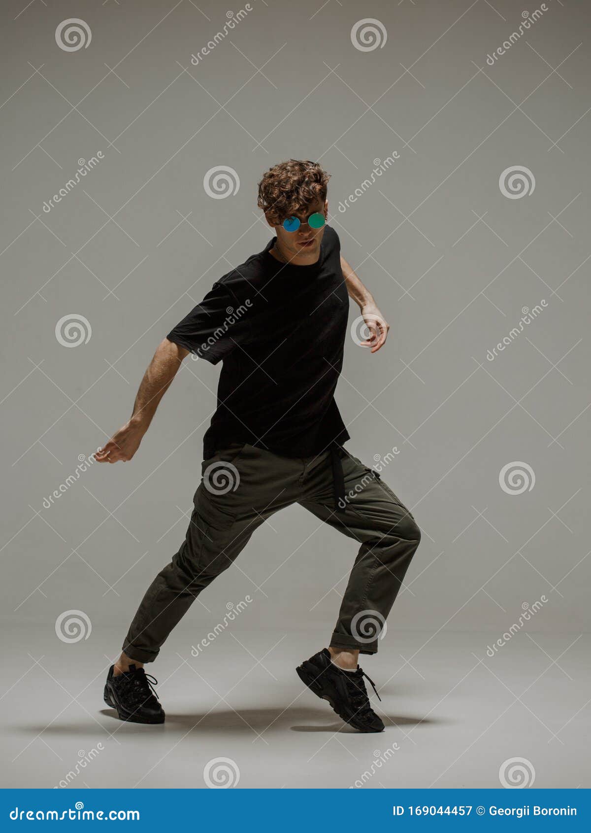 Guy Dancing Contemporary Dance in Studio. Neutral Grey Background ...