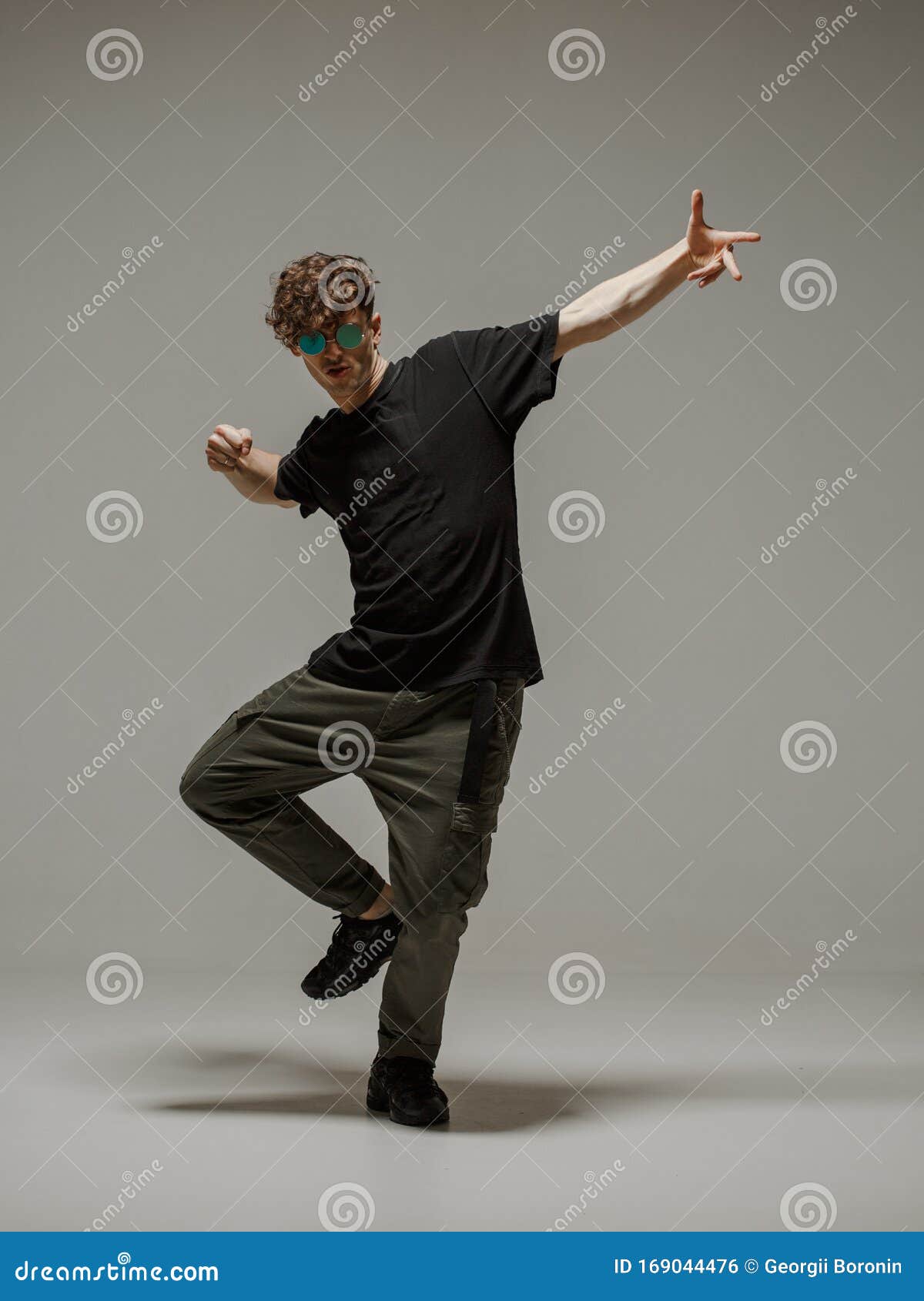 Guy Dancing Contemporary Dance in Studio. Neutral Grey Background ...