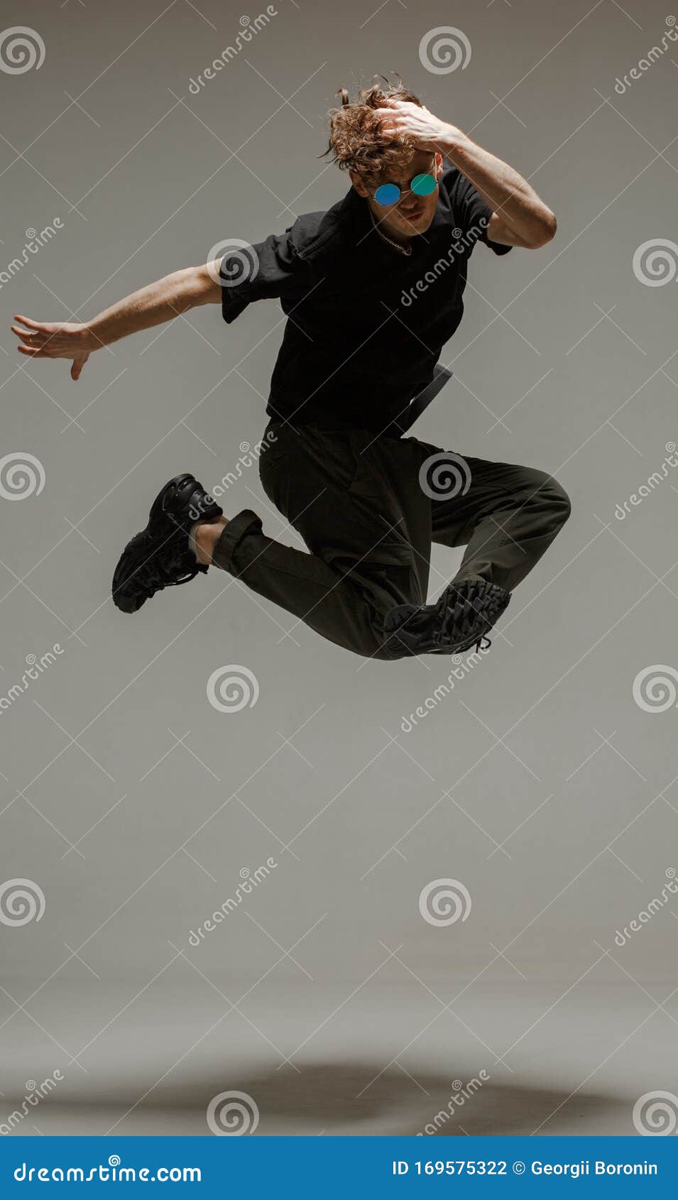 Guy Dancing Contemporary Dance in Studio. Neutral Grey Background ...