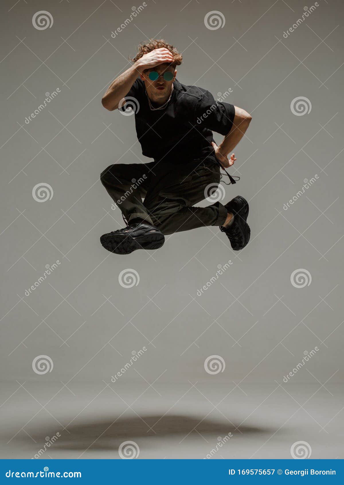 Guy Dancing Contemporary Dance in Studio. Neutral Grey Background ...