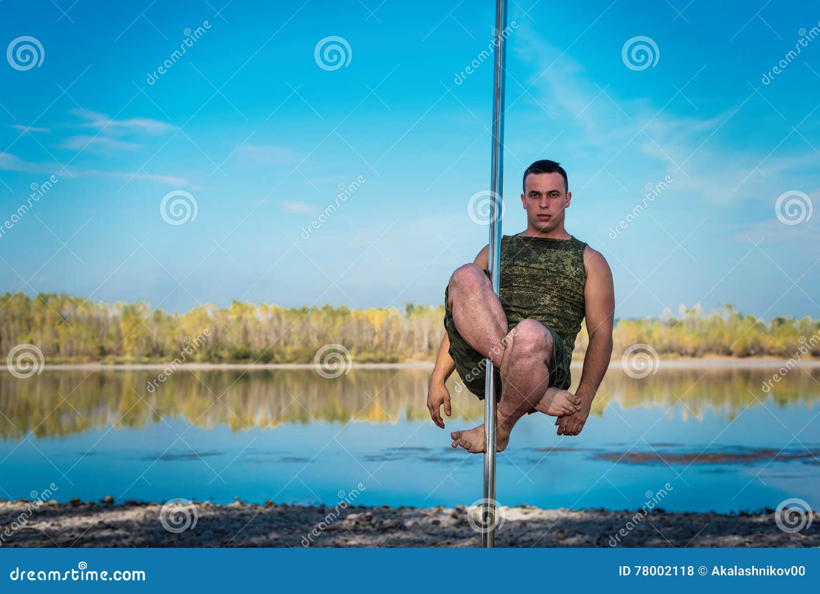 Guy dancing on a pole stock photo. Image of athletic - 78002118