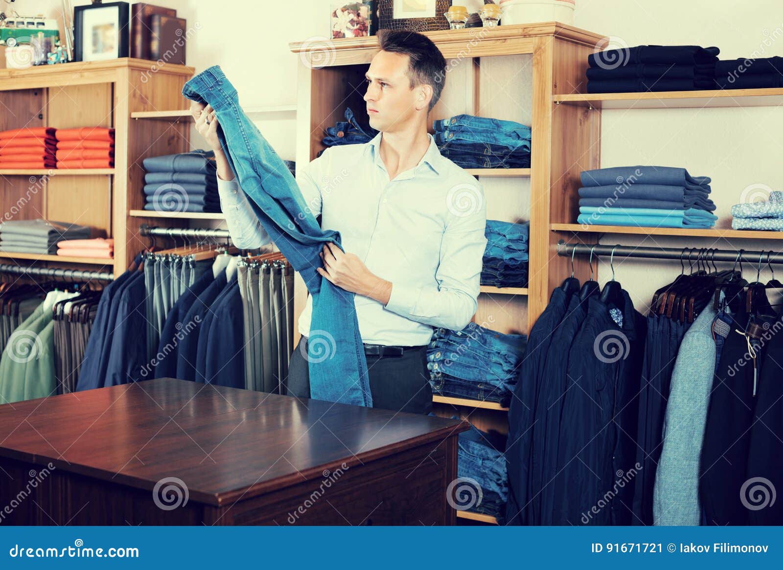 Guy is Deciding on for New Jeans Stock Image - Image of indoors ...