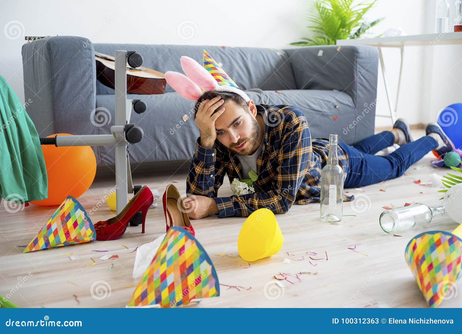 Hangover after a party stock image. Image of couch, person - 100312363