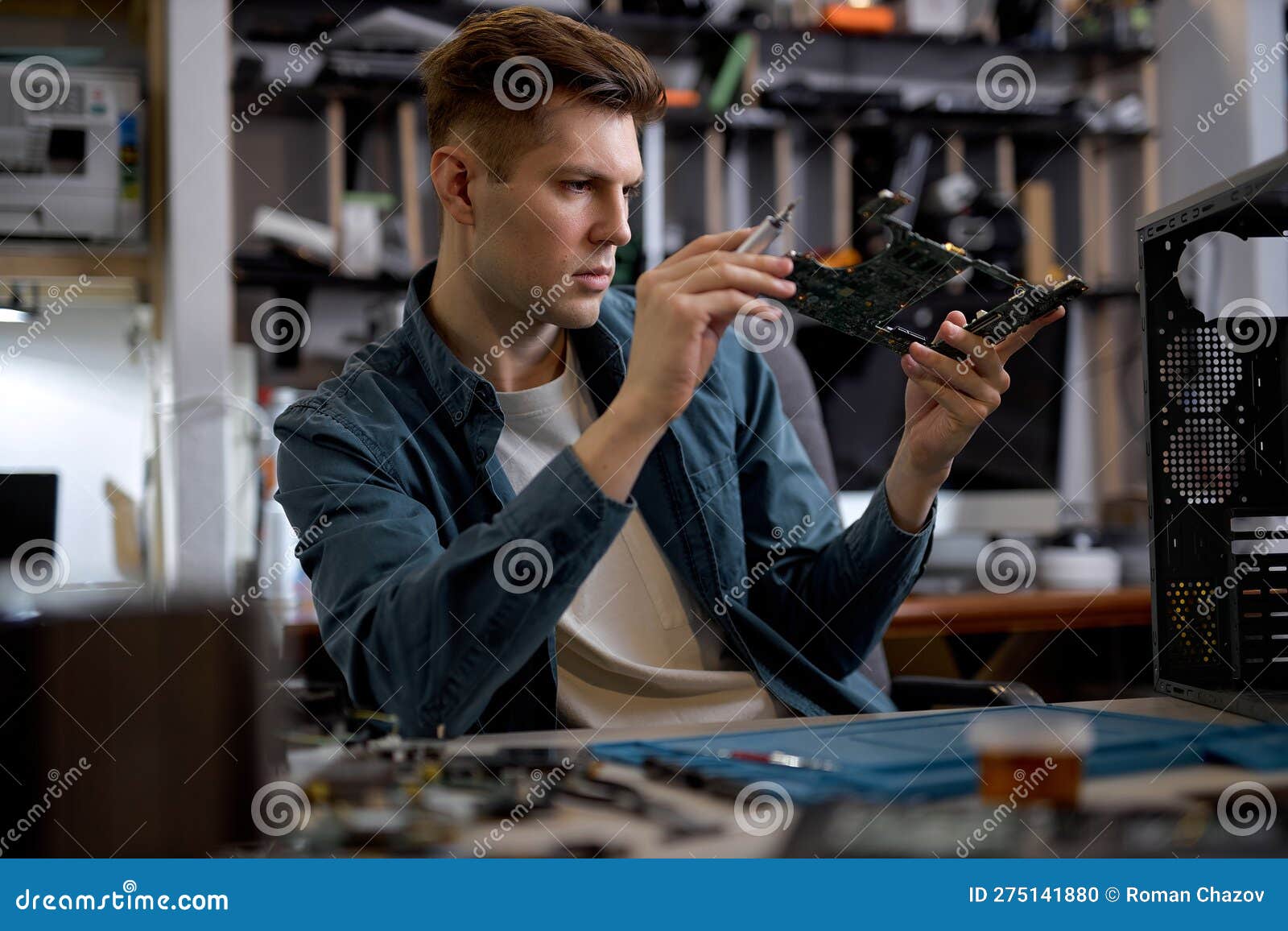 Guy Disassembles Broken Laptop. Computer Service and Repair Concept ...