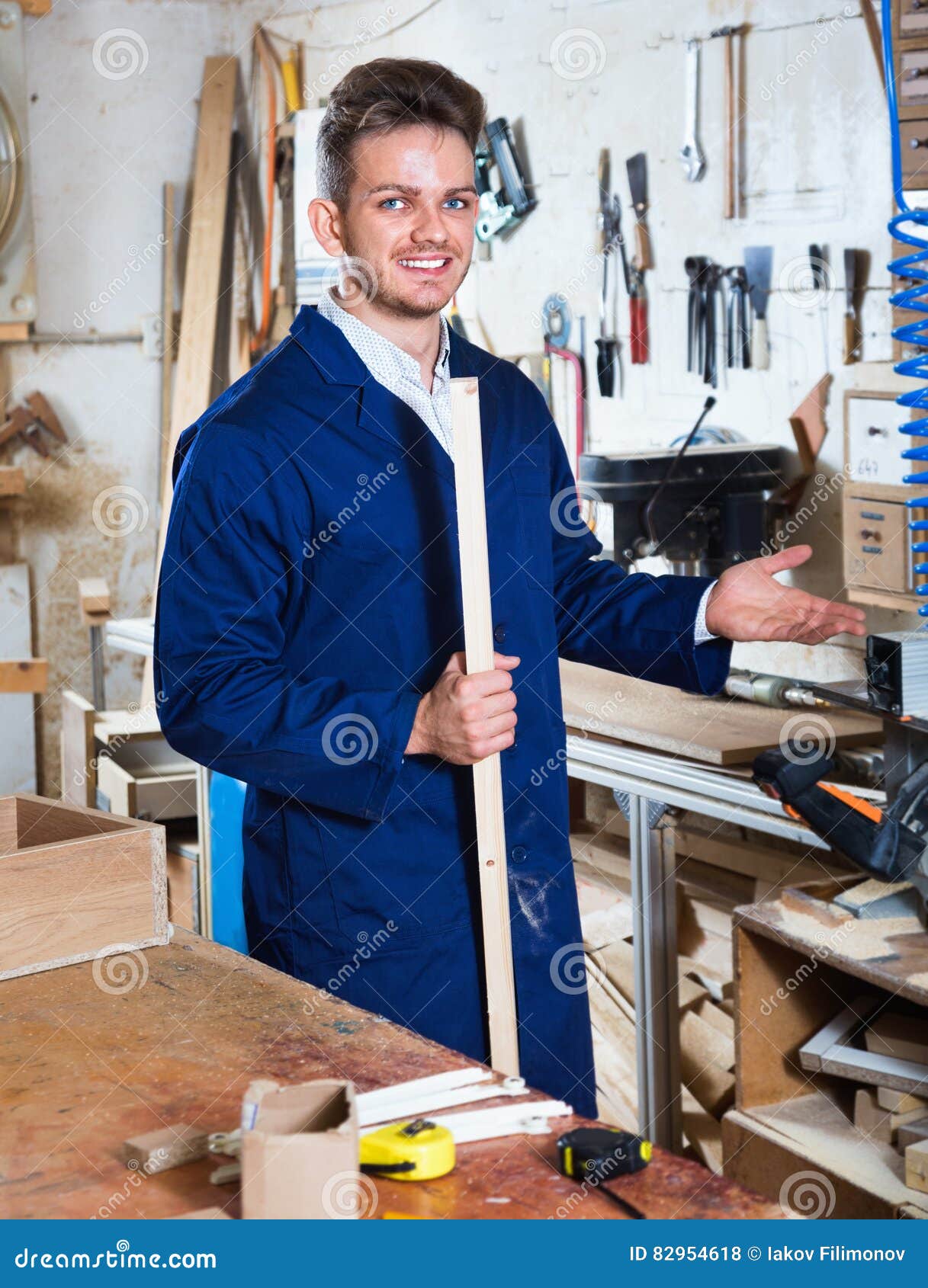 Guy Displaying His Workplace and Tools at Workshop Stock Photo - Image ...