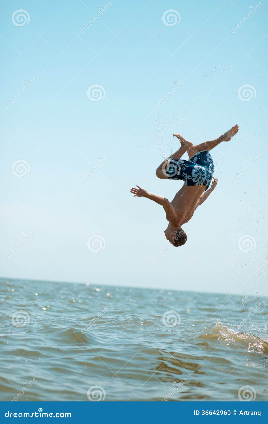 Guy Doing a Somersault on Sea Background Stock Photo - Image of jumping ...