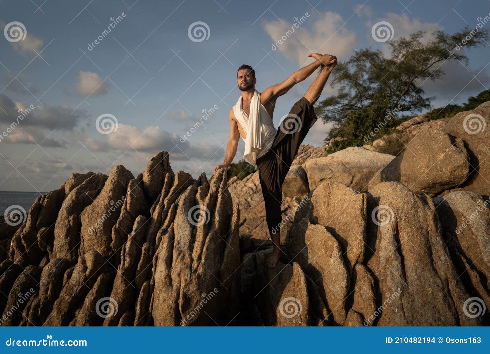 Guy Doing Yoga Poses on Sharp Rocks Near the Beach in Thailand Stock ...