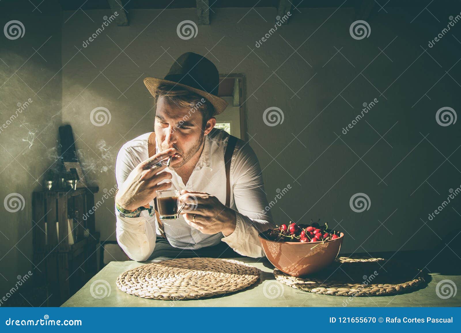 Guy Drinking Coffee and Smoking a Cigarette. Stock Photo - Image of ...