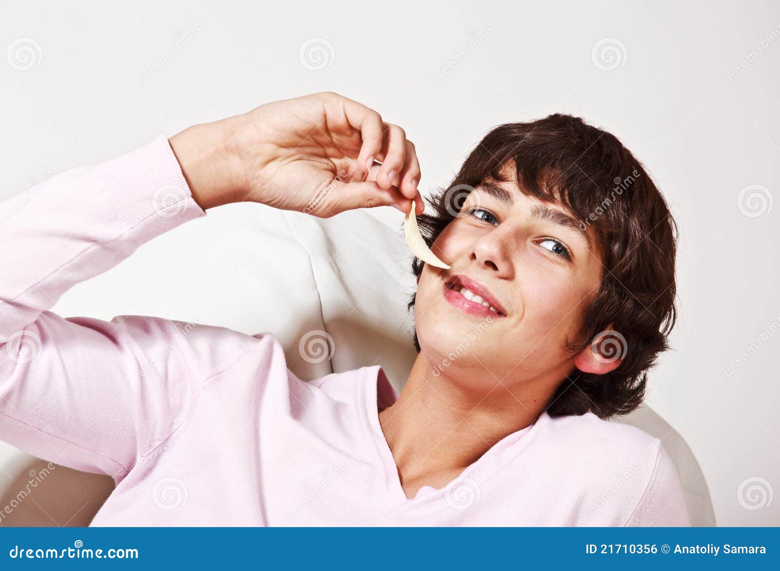 Guy eating crisps stock photo. Image of shot, male, fashion - 21710356