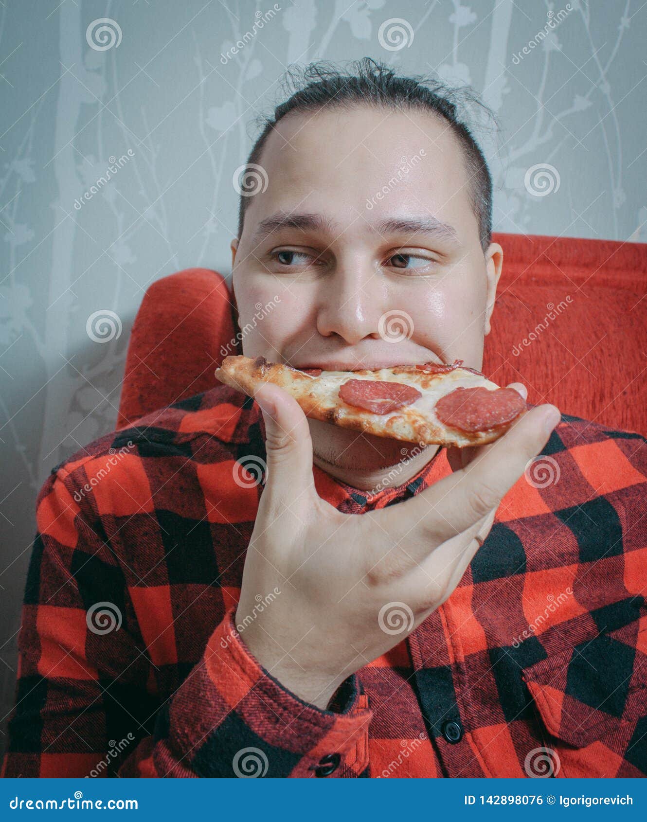 Guy eating pizza stock photo. Image of office, fast - 142898076