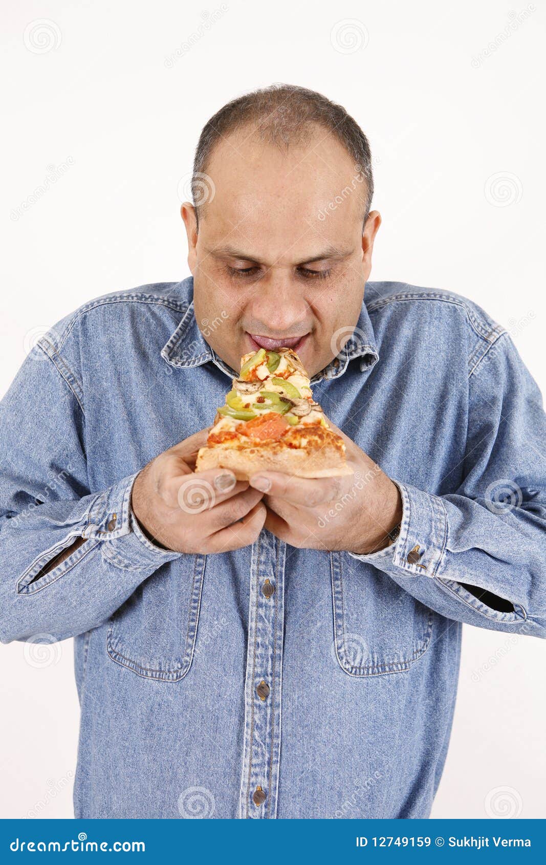 Guy eating pizza slice stock image. Image of baked, sauce - 12749159