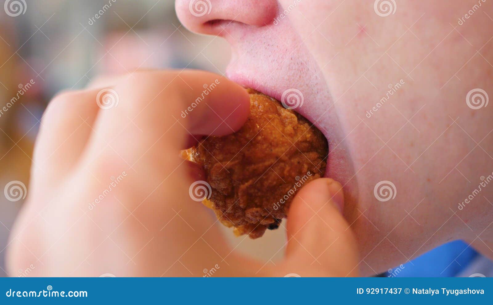 Guy Eats Fried Chicken in a Fast Food Restaurant Closeup Stock Image ...