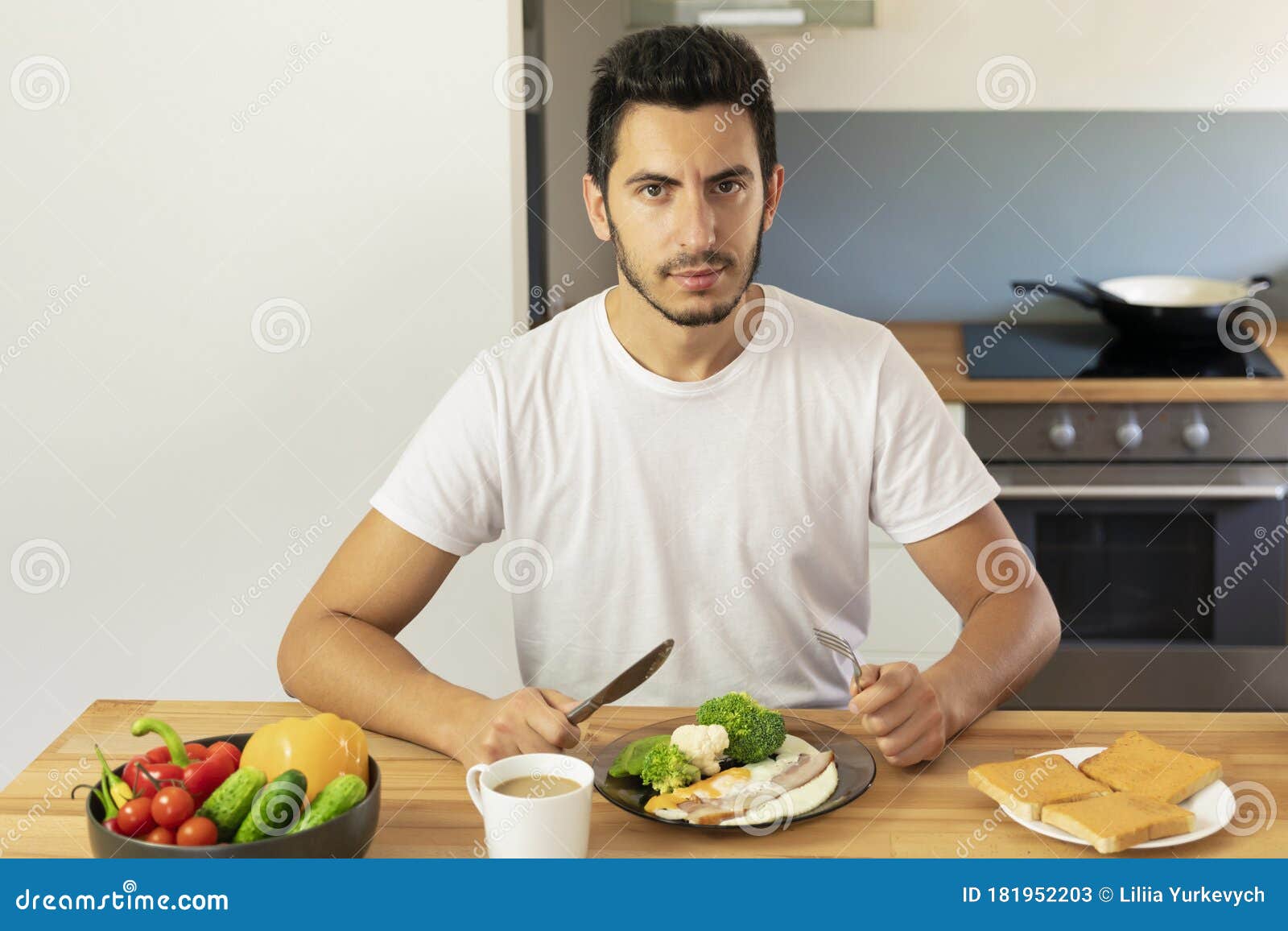 The Guy Eats Toast and Scrambled Eggs with Bacon Stock Image - Image of ...