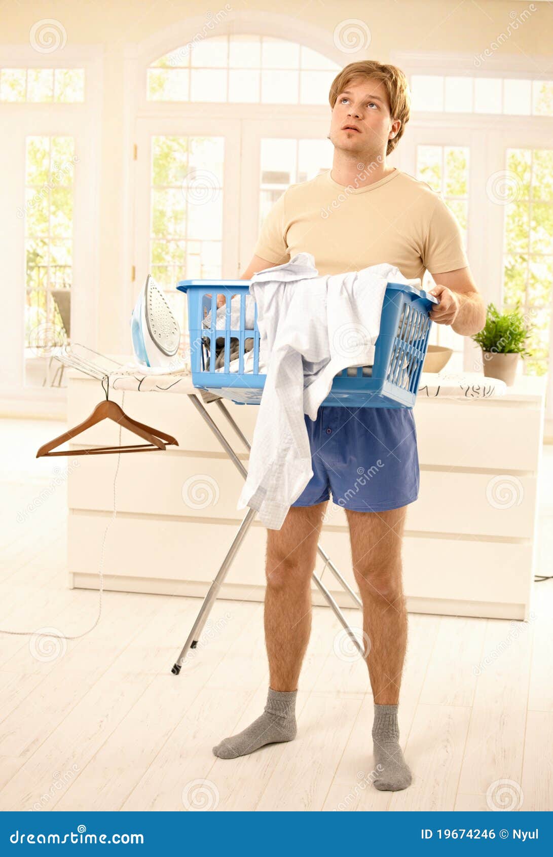 Guy fed up with housework stock photo. Image of american - 19674246