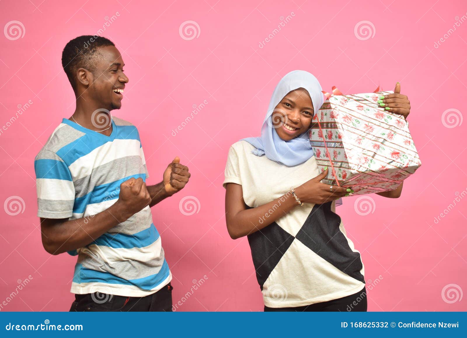 Guy Feeling Excited with Girlfriend after Giving Her a Present Stock ...
