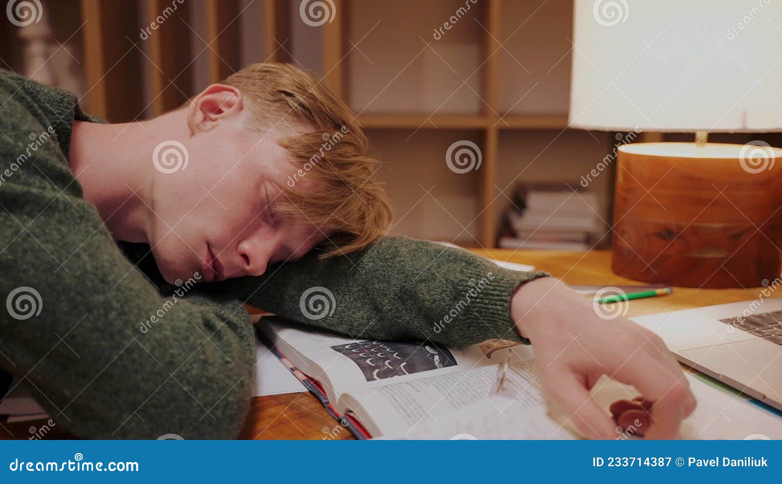 Guy Fell Asleep while Doing Homework at the Table, Lying on Books, Side ...
