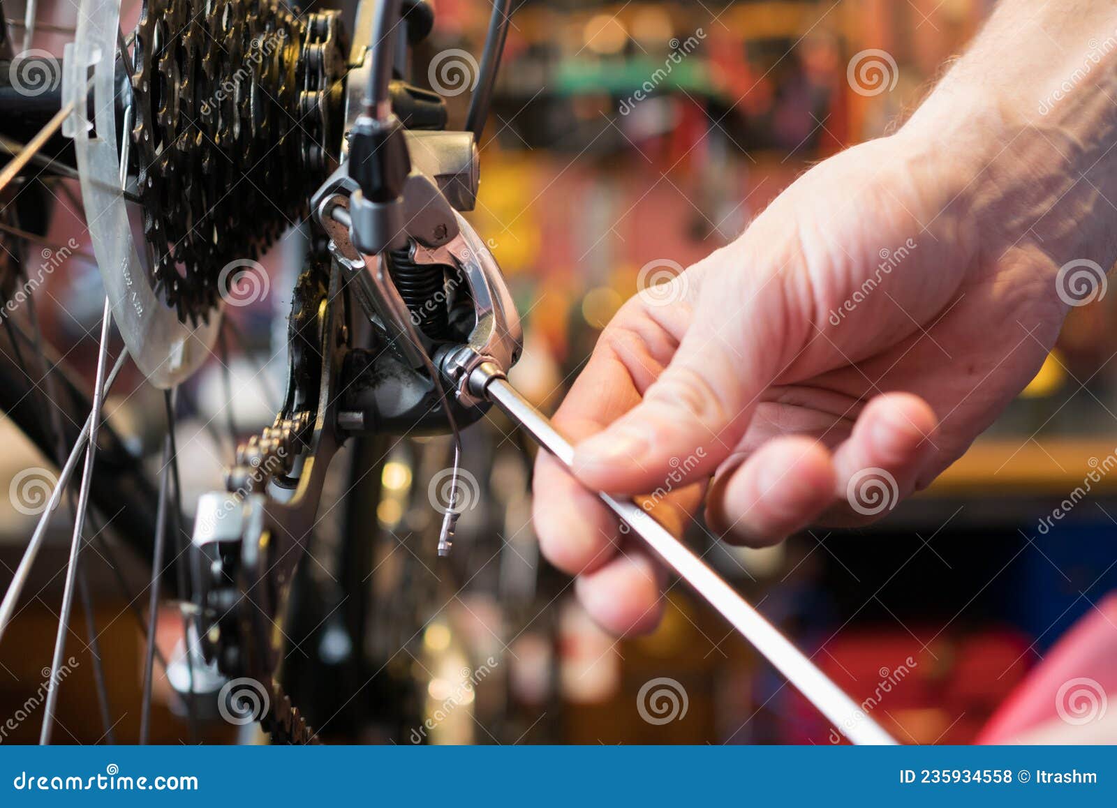 Guy Fixing Bicycle in Garage Stock Photo - Image of bicyclist, hexagon ...