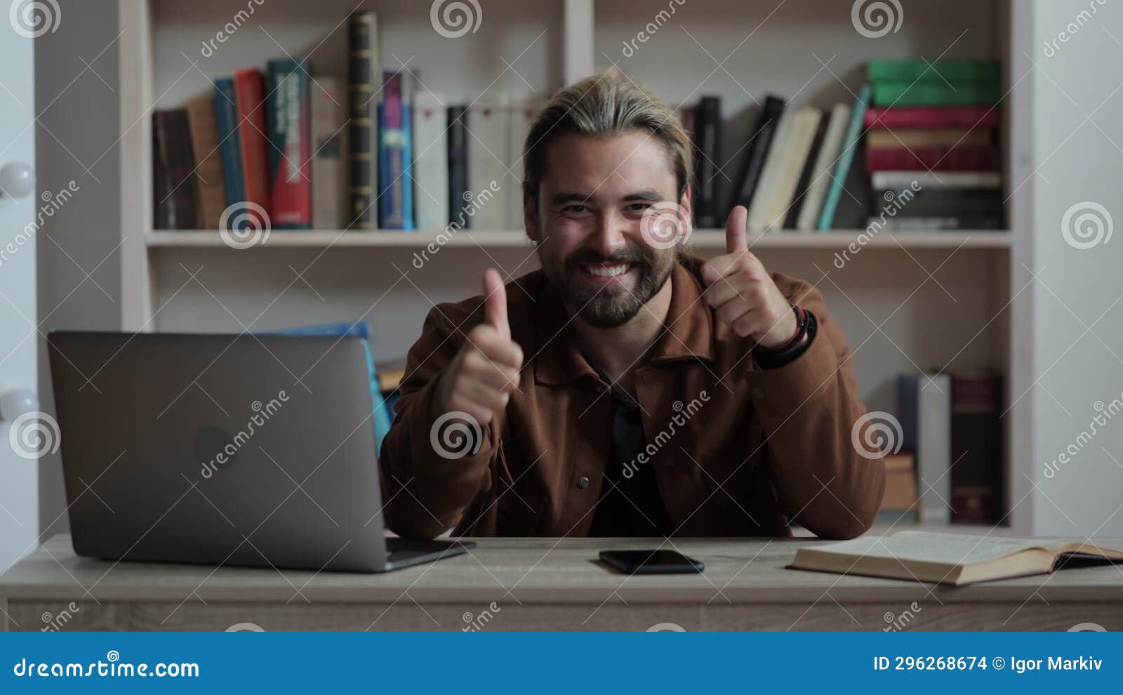 Guy Gesturing Thumbs Up while Sitting Desk with Gadgets Stock Footage ...