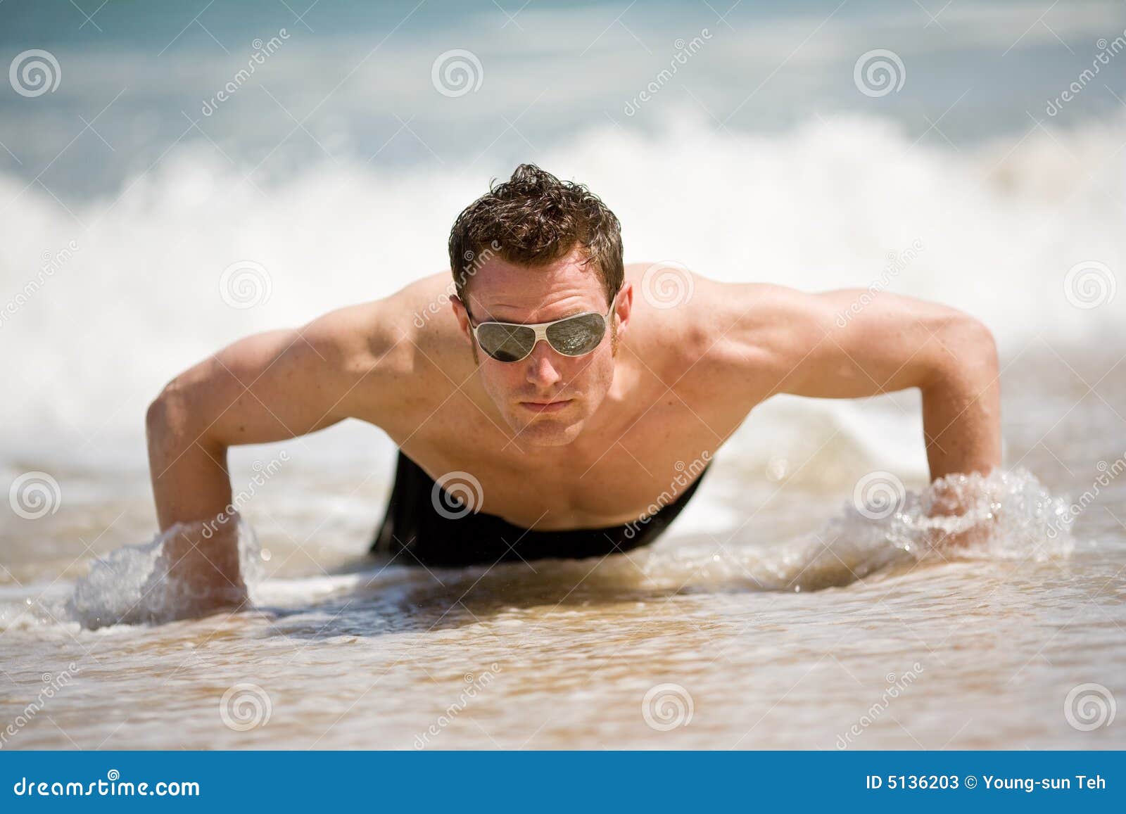 Guy Getting Up from the Beach Stock Image - Image of hunk, pumping: 5136203