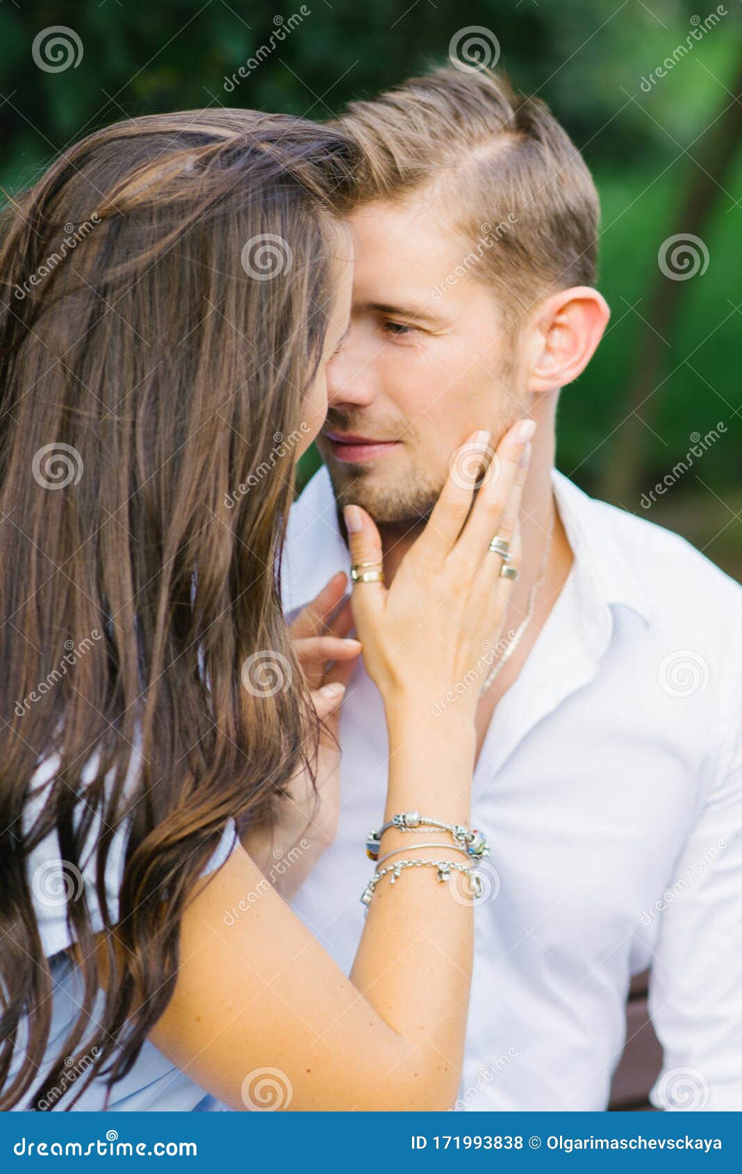 A Guy And A Girl A Couple In Love Touched Each Other`s Faces The